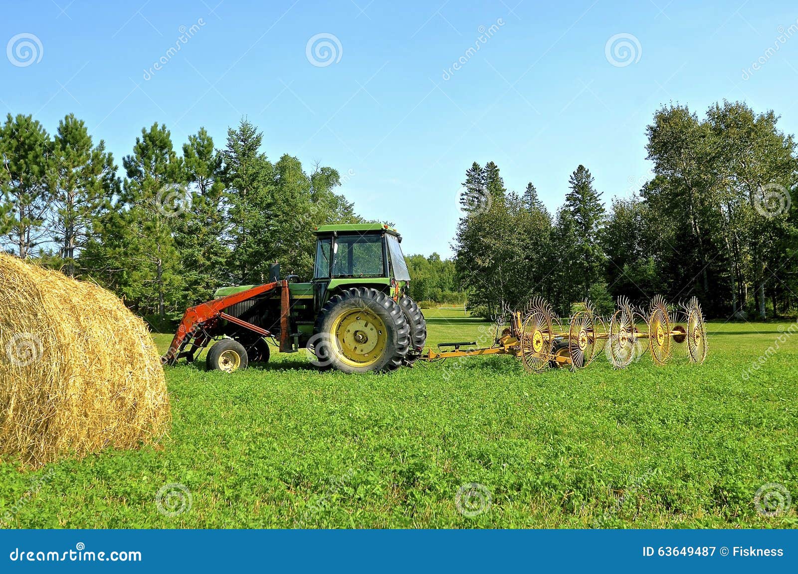 Bale, Tractor, and Wheel Rake Stock Image - Image of farming, wheels ...