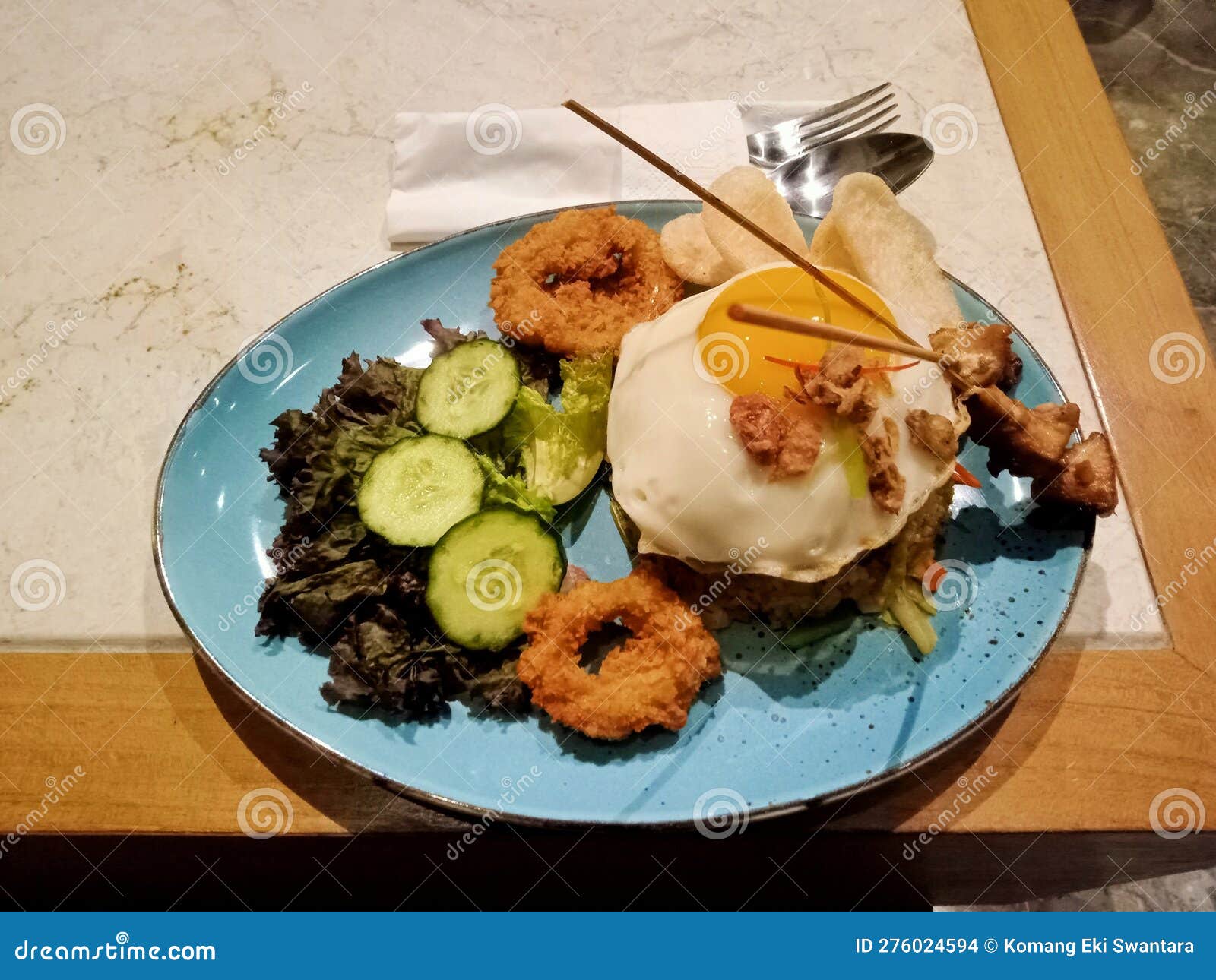 Balinese Fried Rice Menu with Soft-boiled Eggs, Chicken Satay, Crispy ...