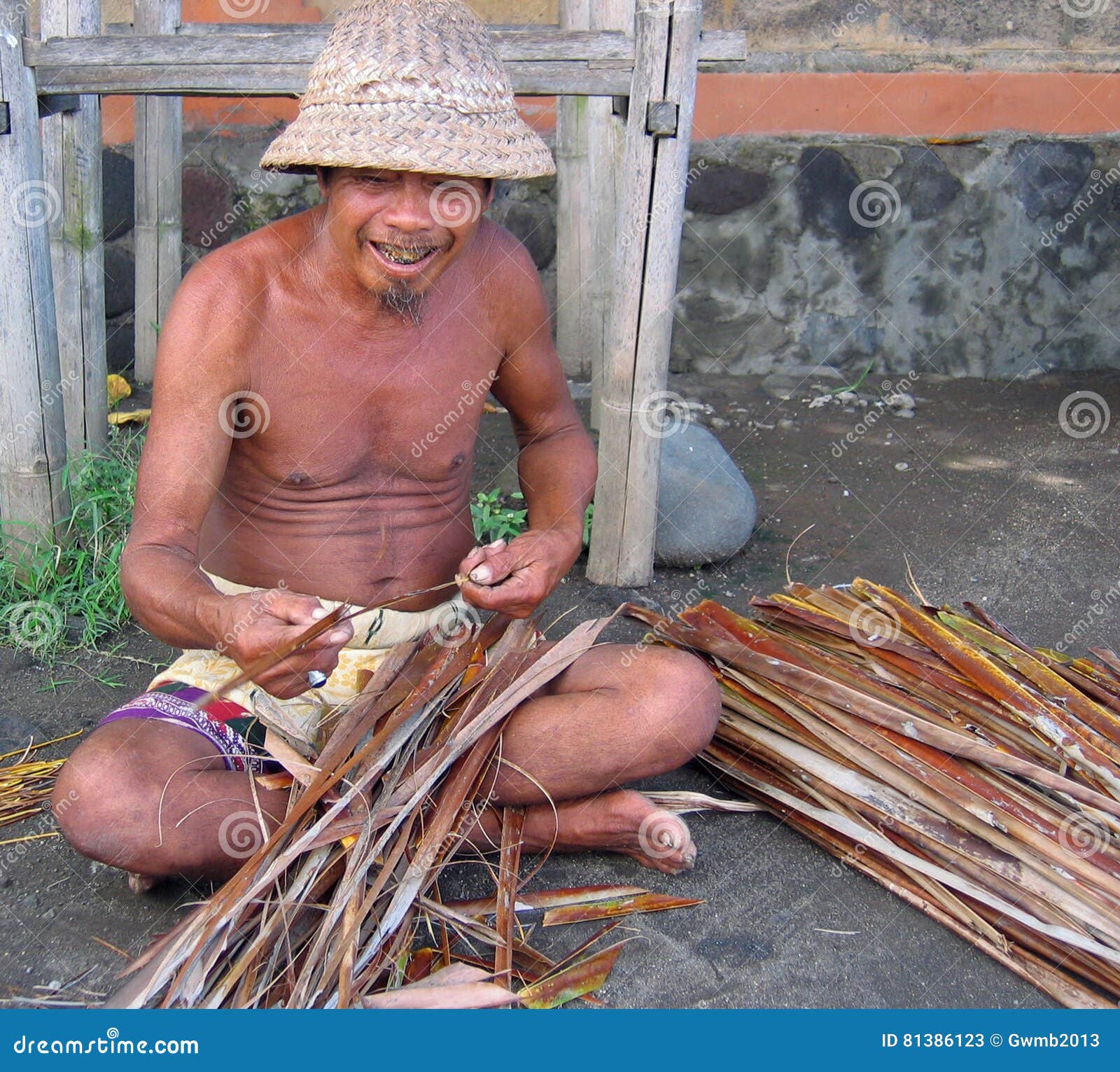 A Balinese Man at Work at Kusamba Beach in Bali, Indonesia. Editorial ...