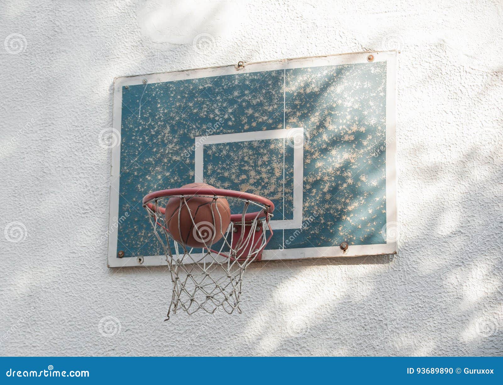 Ball Basketball Going through Rustic Old Hoop with Backboard Stock ...