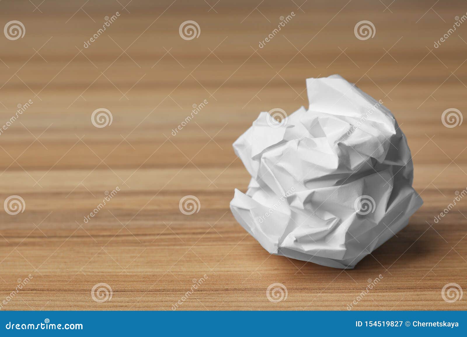 Ball of Crumpled Paper on Wooden Table Stock Image - Image of creative ...