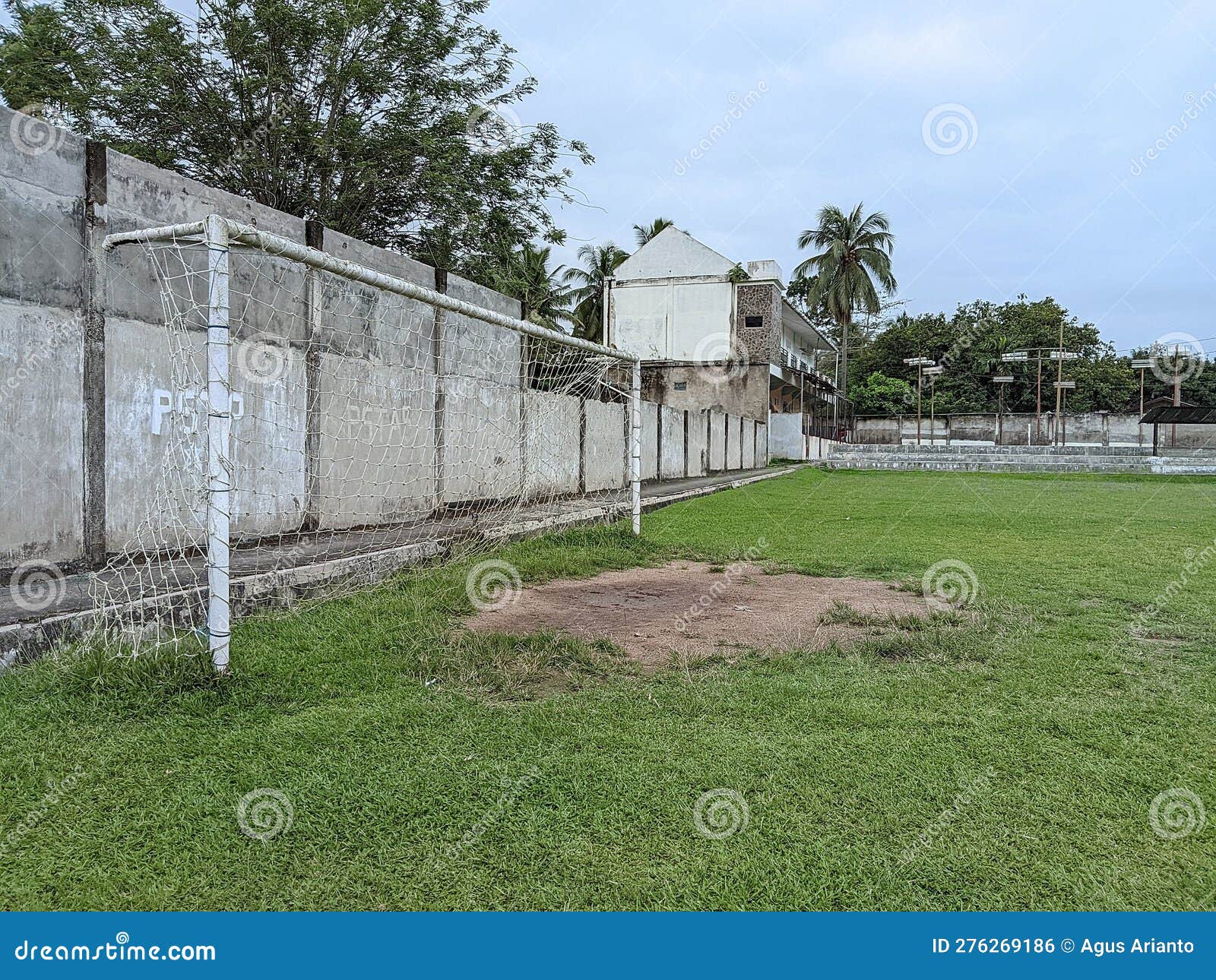 Ball Field with Broken and Muddy Grass Stock Photo - Image of corner ...