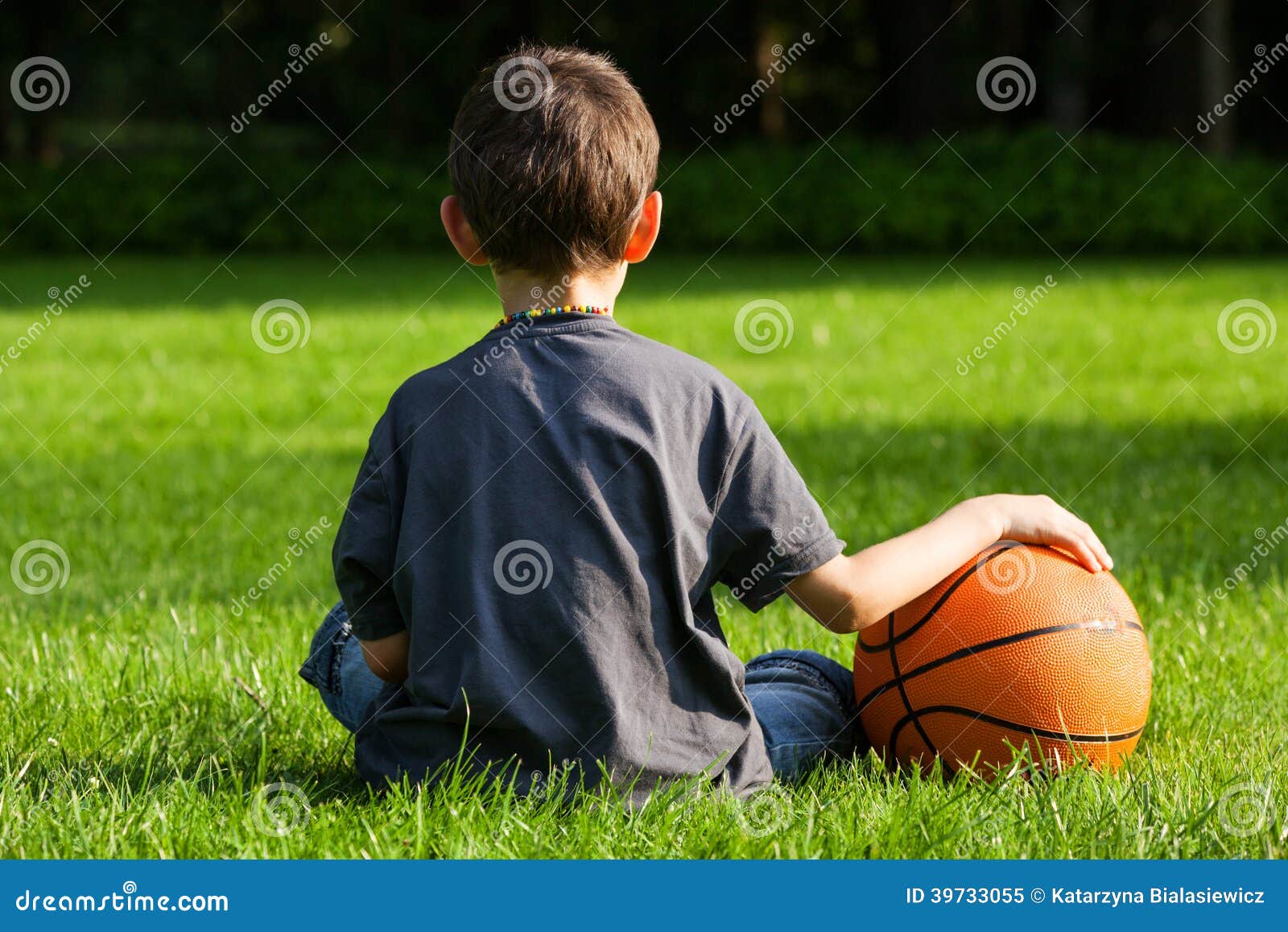 Ball held on the grass stock image. Image of childhood - 39733055