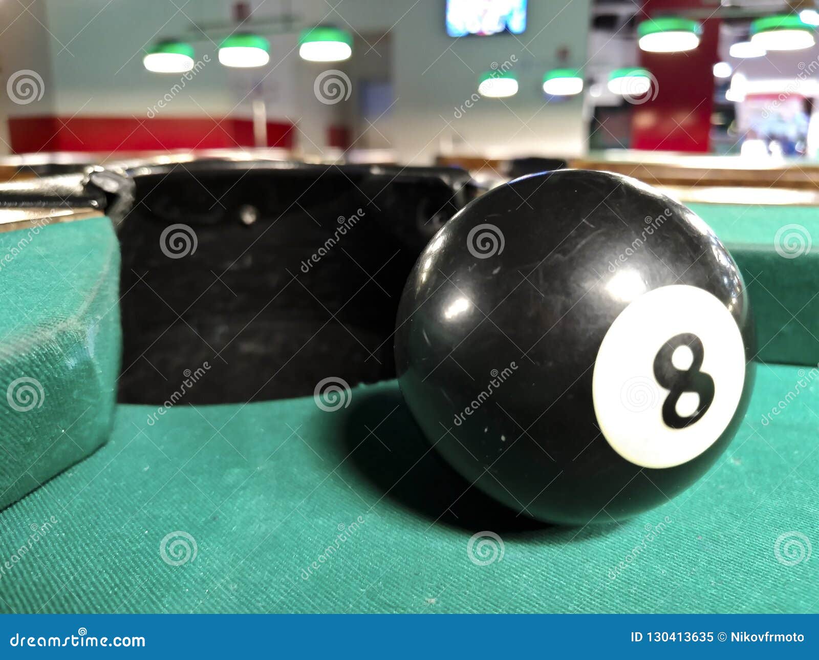 8 ball next to a hole stock image. Image of ball, green - 130413635