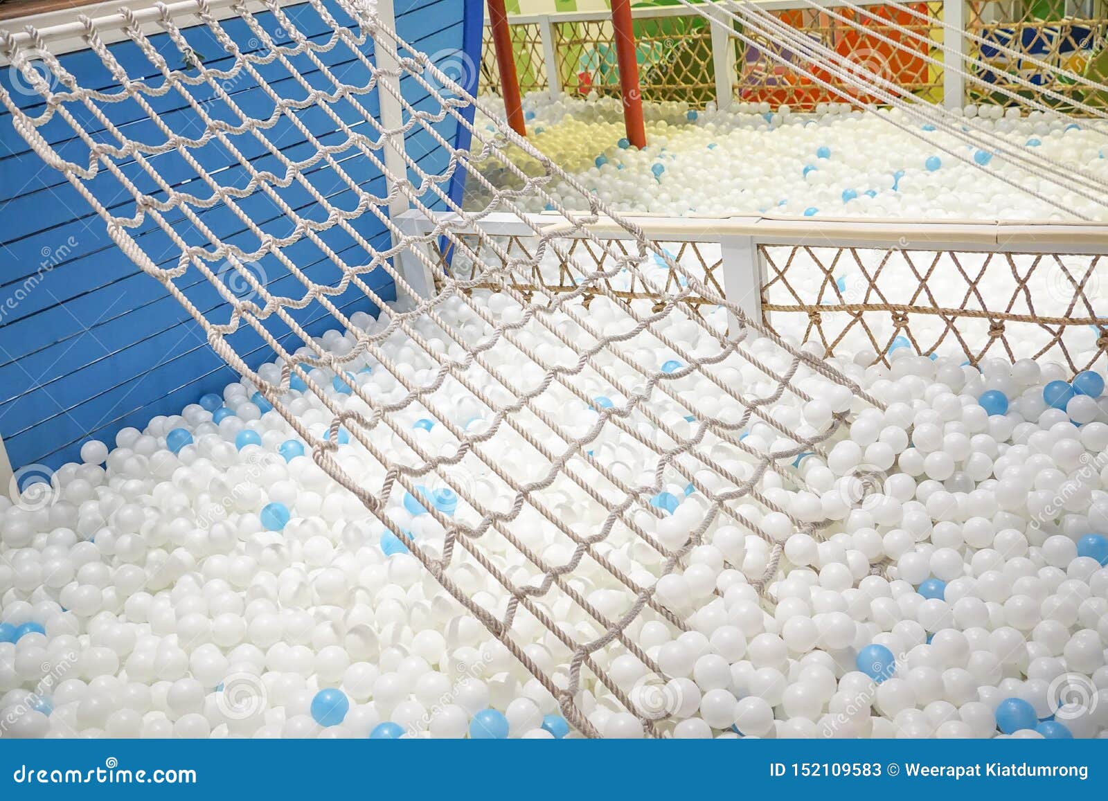Ball pit with climbing net stock image. Image of time - 152109583