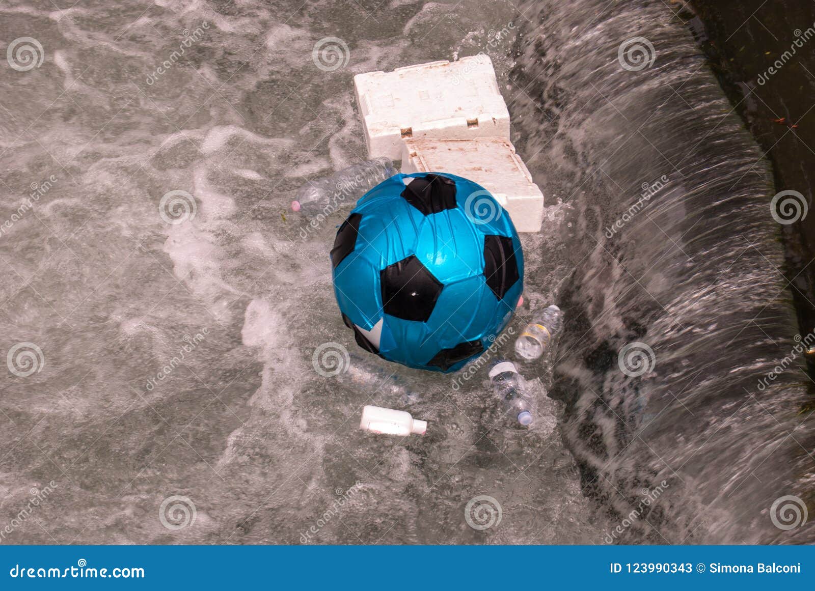 Ball and Plastics Bottles and Boxes Floating in the River Stock Image ...
