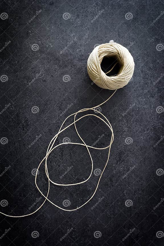 Ball of string on slate stock photo. Image of packaging - 68751640