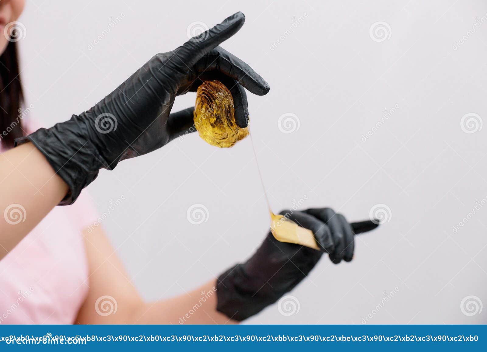 A Ball of Sugar Paste in the Hands of Black Gloves. Preparing for the ...