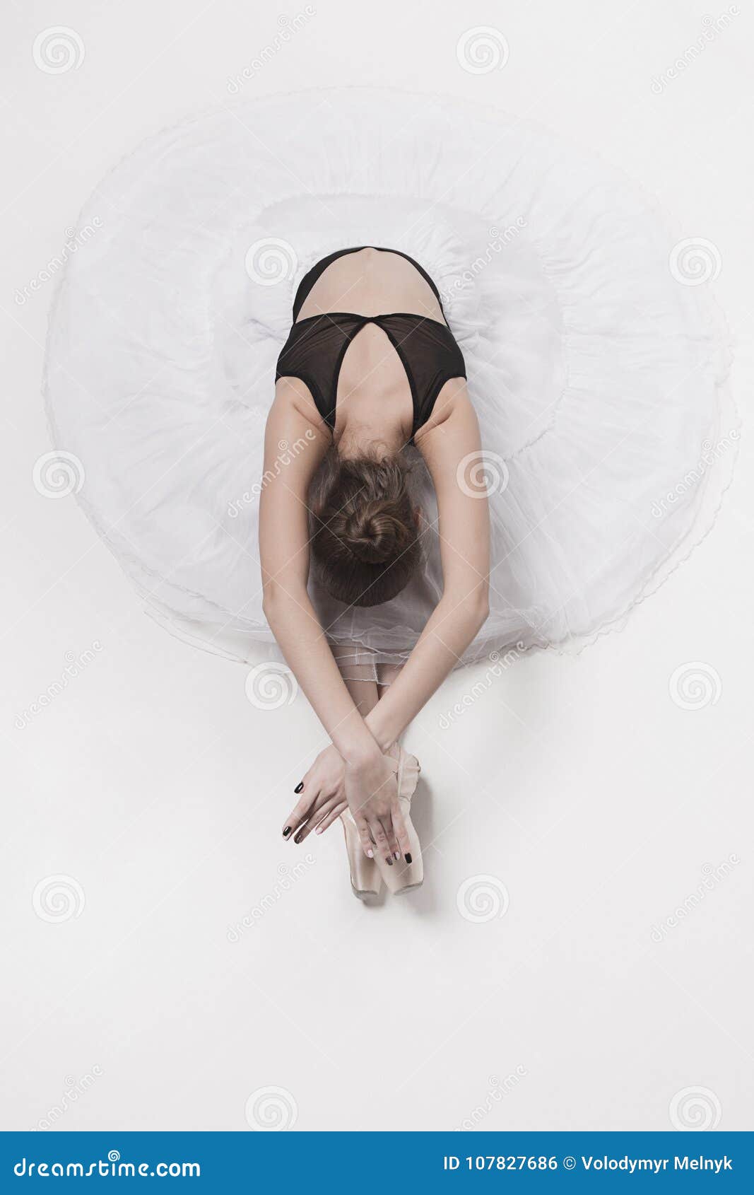 Ballerina Dancer Sitting Down with Her Legs Crossed Stock Photo - Image of modern, action: 107827686