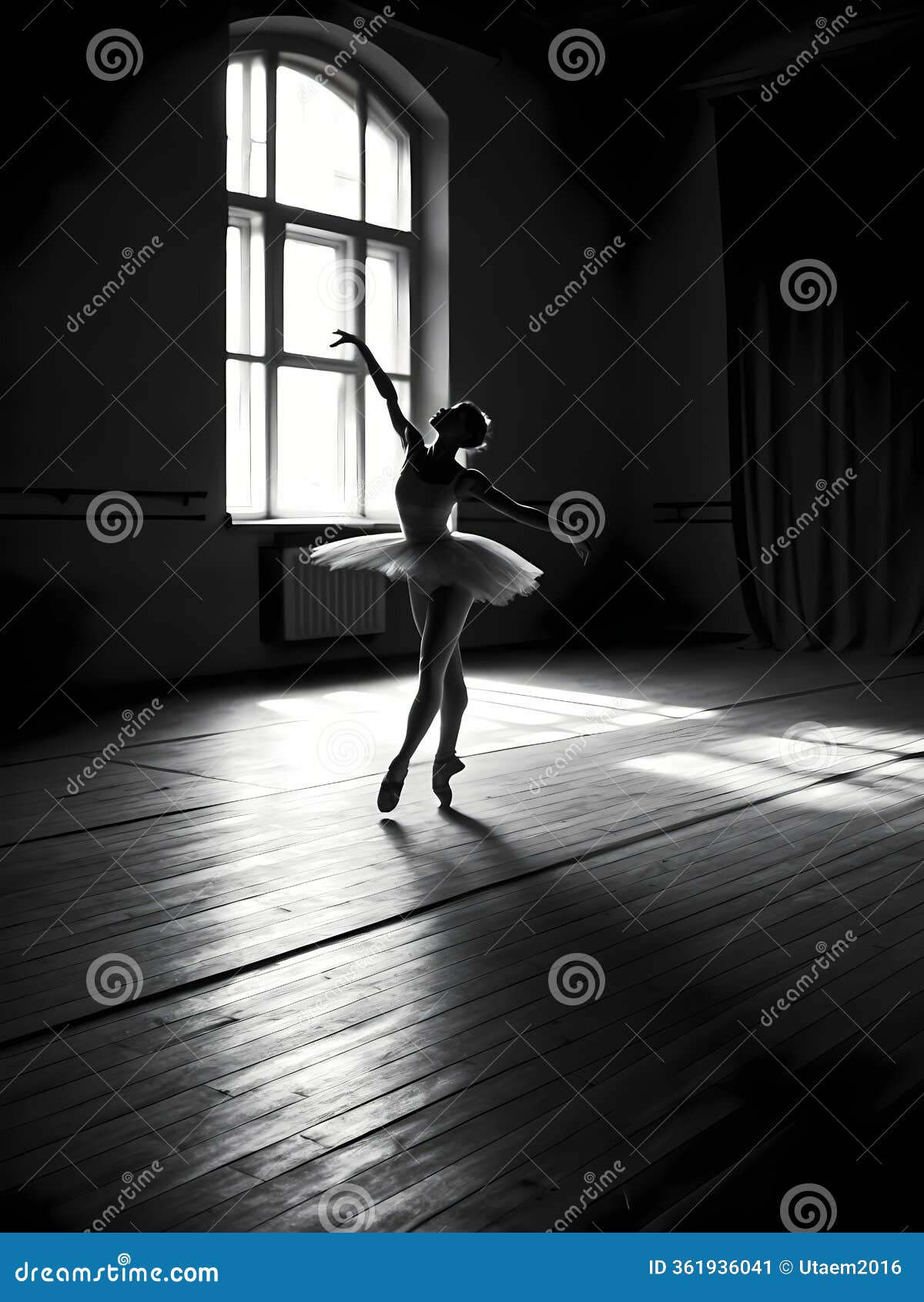 Ballerina Dancing in a Dark Ballet Studio with Natural Light from ...
