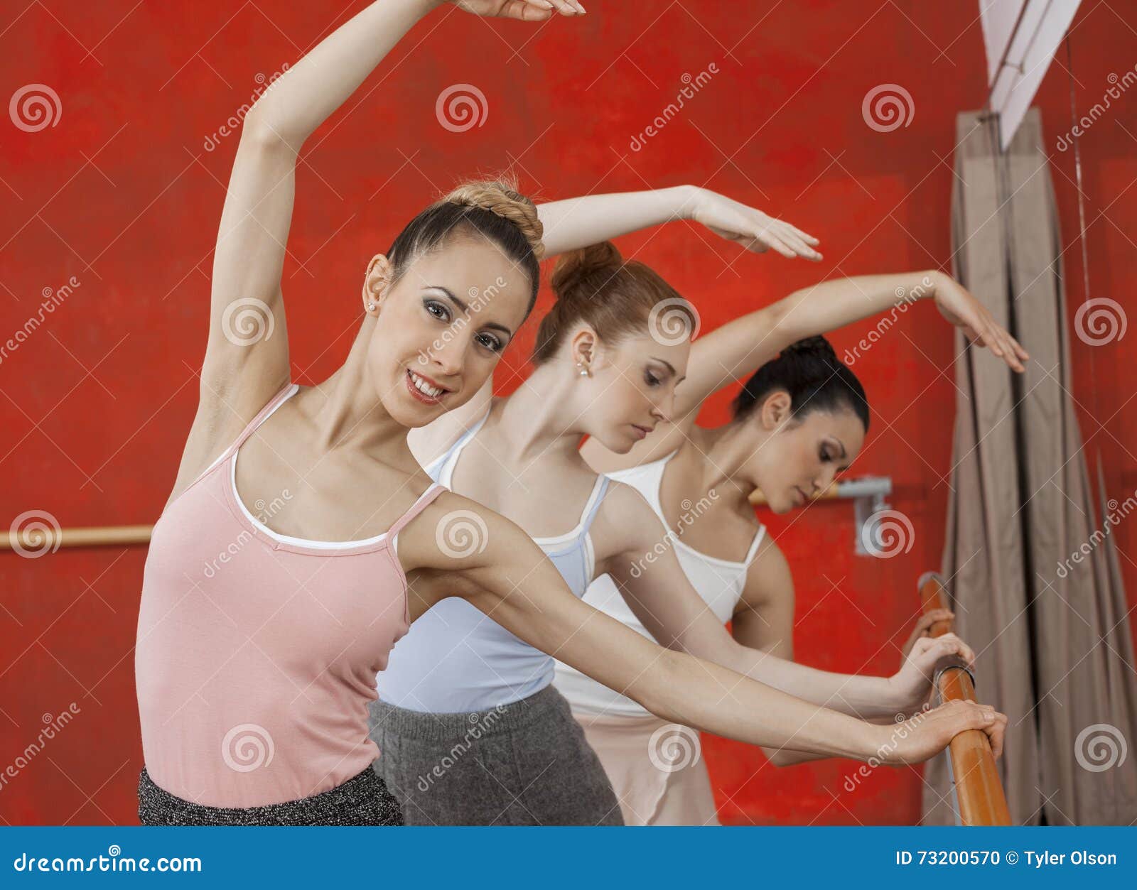Ballerina Performing with Friends in Dance Studio Stock Photo - Image ...