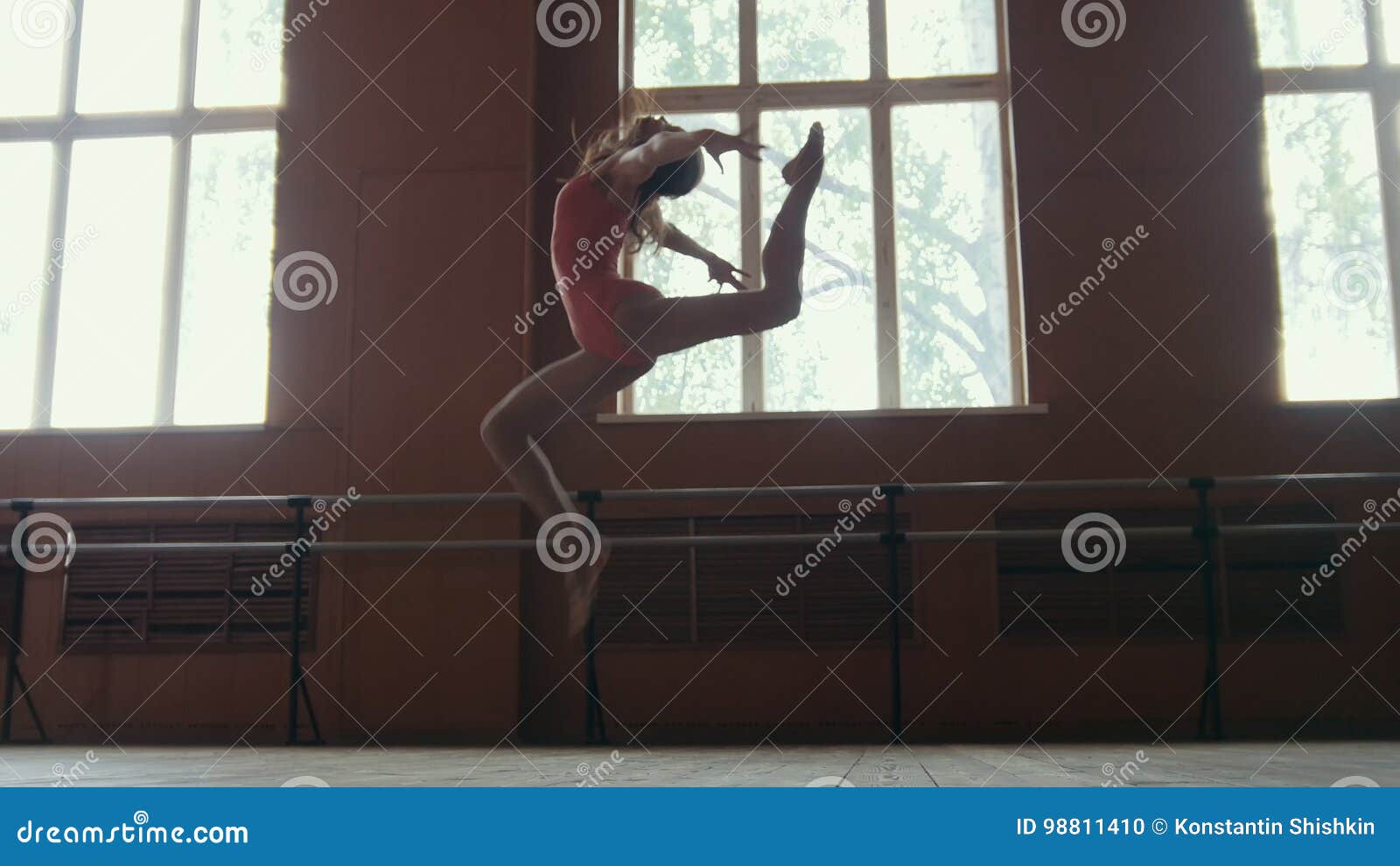 Ballerina Performs Acrobatics Tricks in Studio Stock Photo - Image of ...