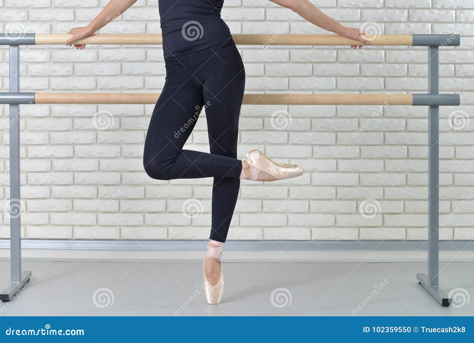 Ballerina Practicing Ballet at Dance Studio Near Barre. Stock Photo ...