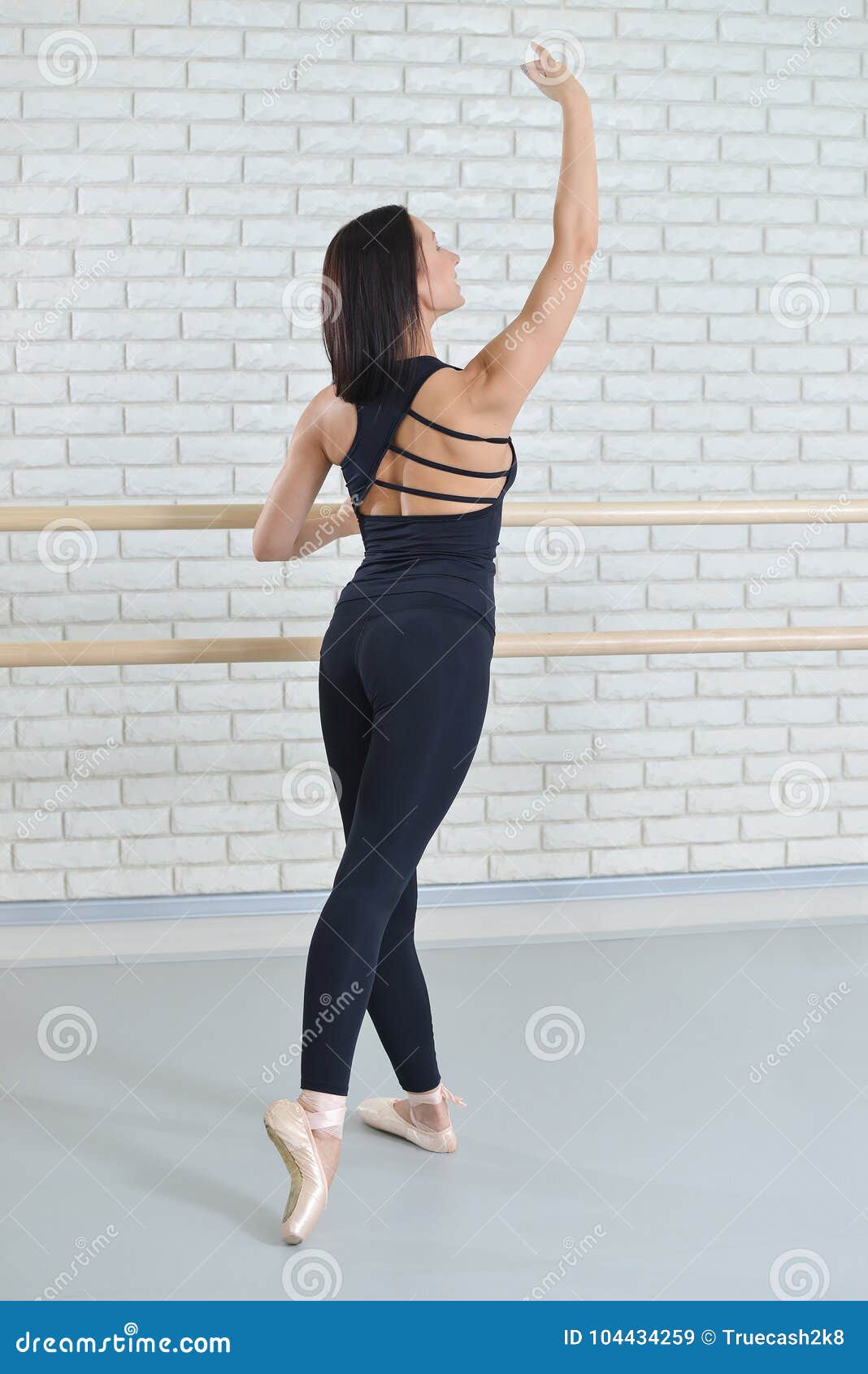 Ballerina Practicing Ballet at Dance Studio Near Barre. Stock Image ...