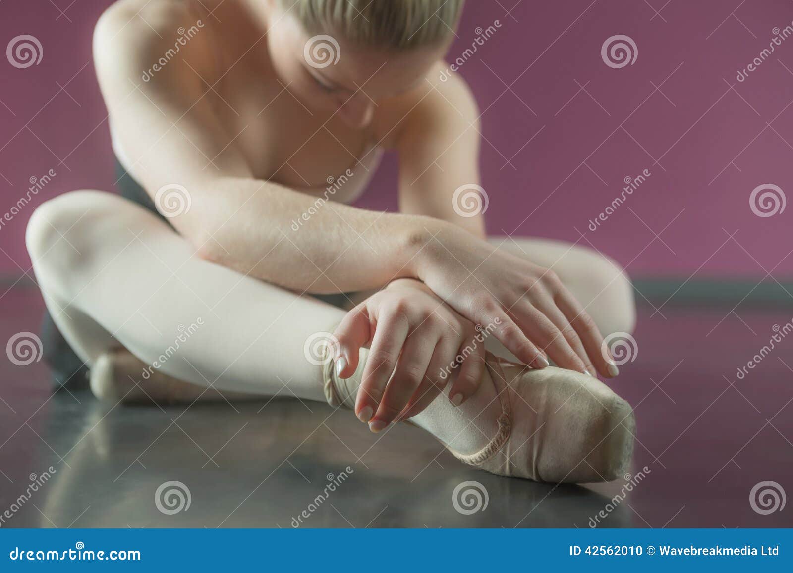 Ballerina Sitting and Bending Forward Stock Photo - Image of young ...