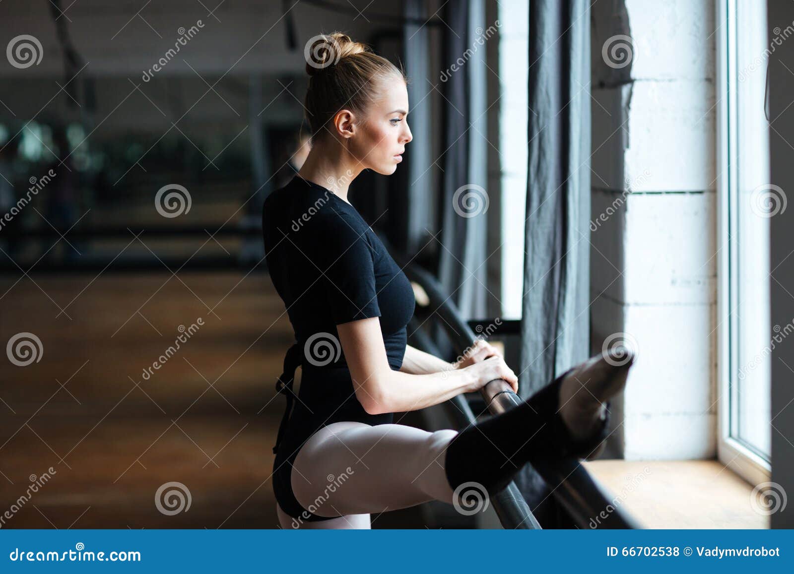 Ballerina Stretching Leg in Ballet Class Stock Photo - Image of dancer ...