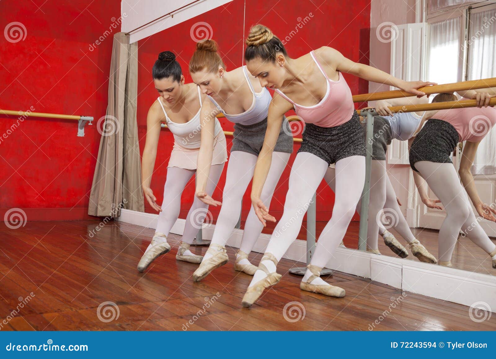 Ballerinas Bending while Performing in Training Studio Stock Photo ...