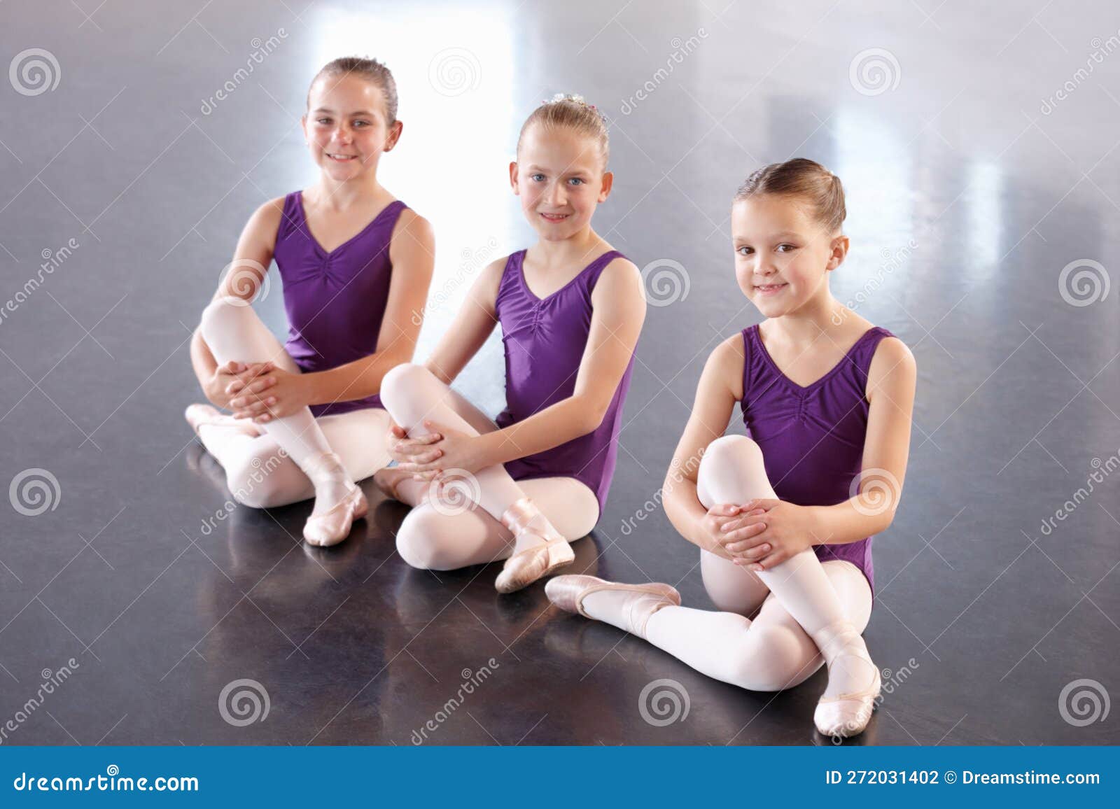 Ballerinas in the Making. Happy Young Ballerinas Sitting in a Ballet ...