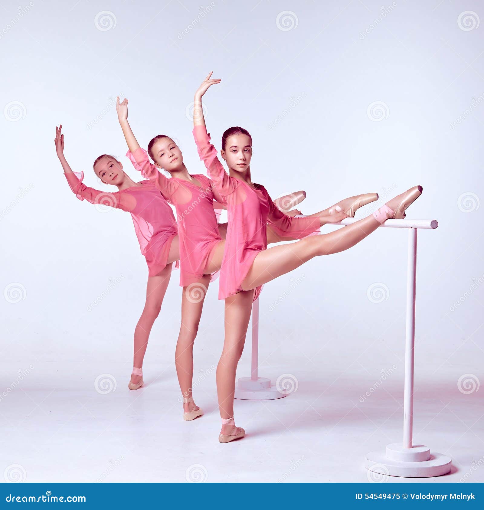 Ballerinas Stretching On The Bar Stock Photo | CartoonDealer.com #54573474