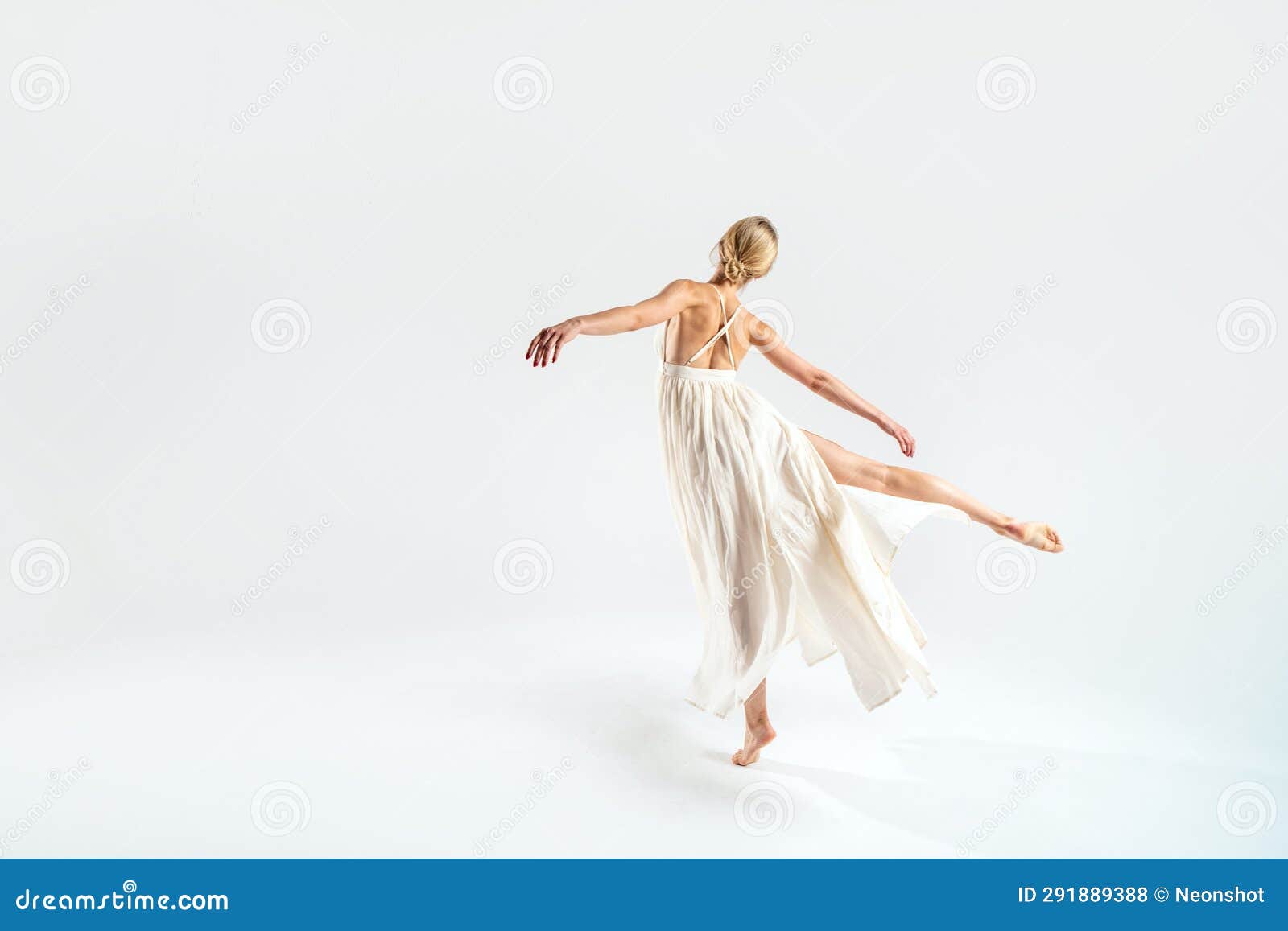 Ballet Dancer Dancing Over Studio Background in Maxi Dress. Back View ...