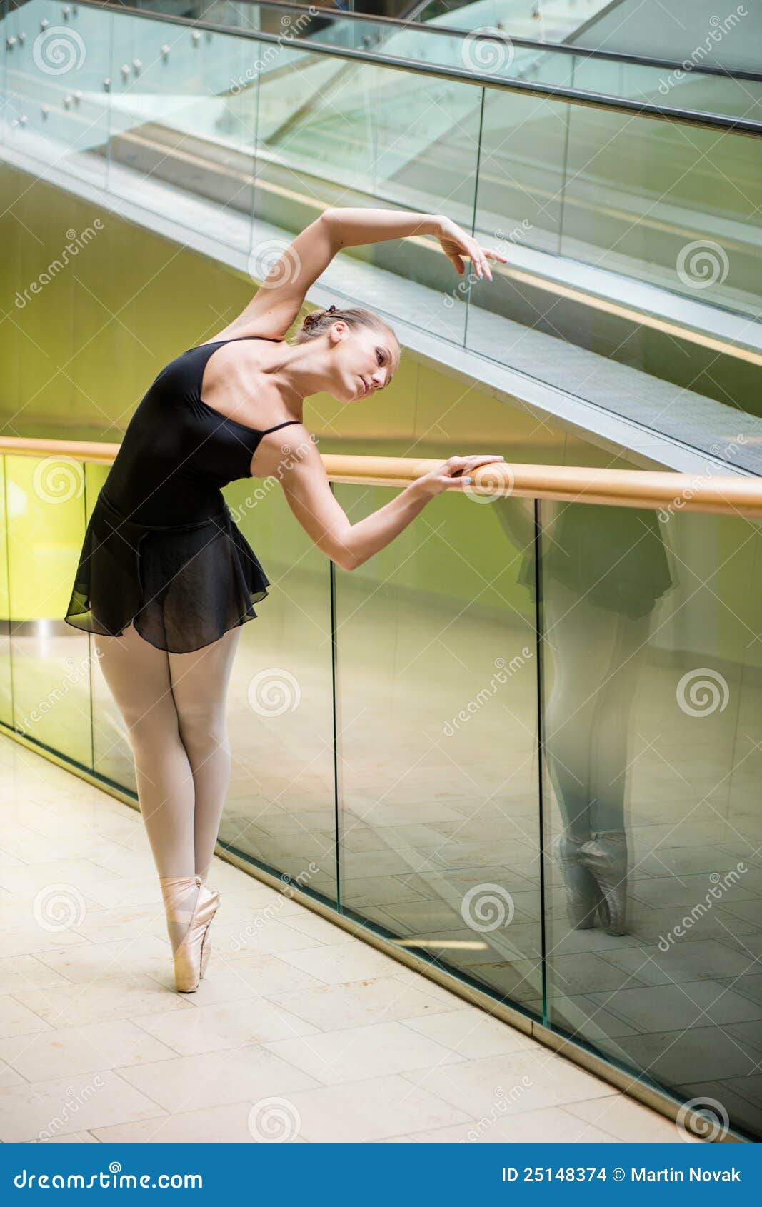 Ballet dancer at escalator stock photo. Image of grace - 25148374