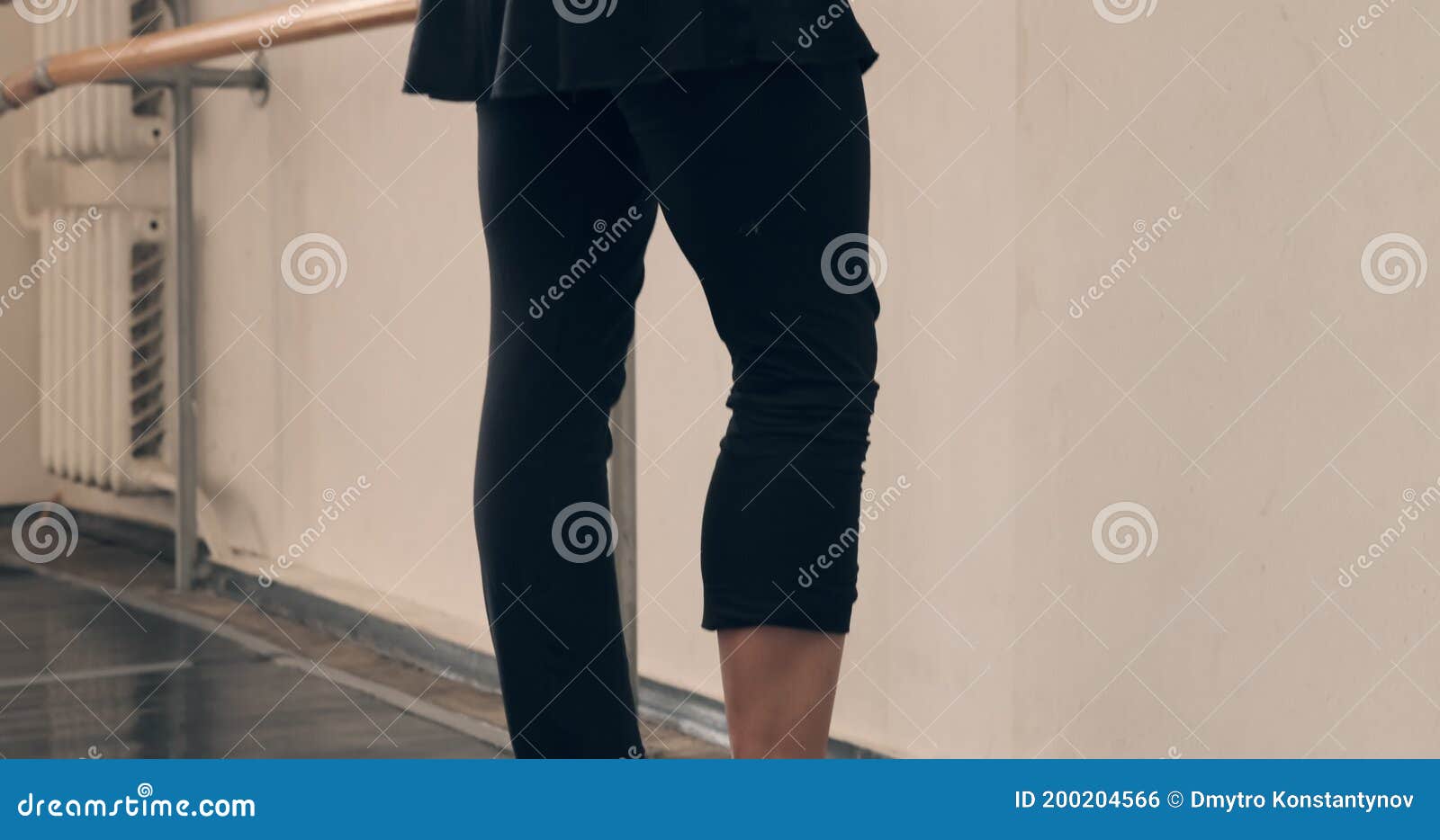 Ballerina Stretching and Practicing Holding Handrail at Dance Hall ...