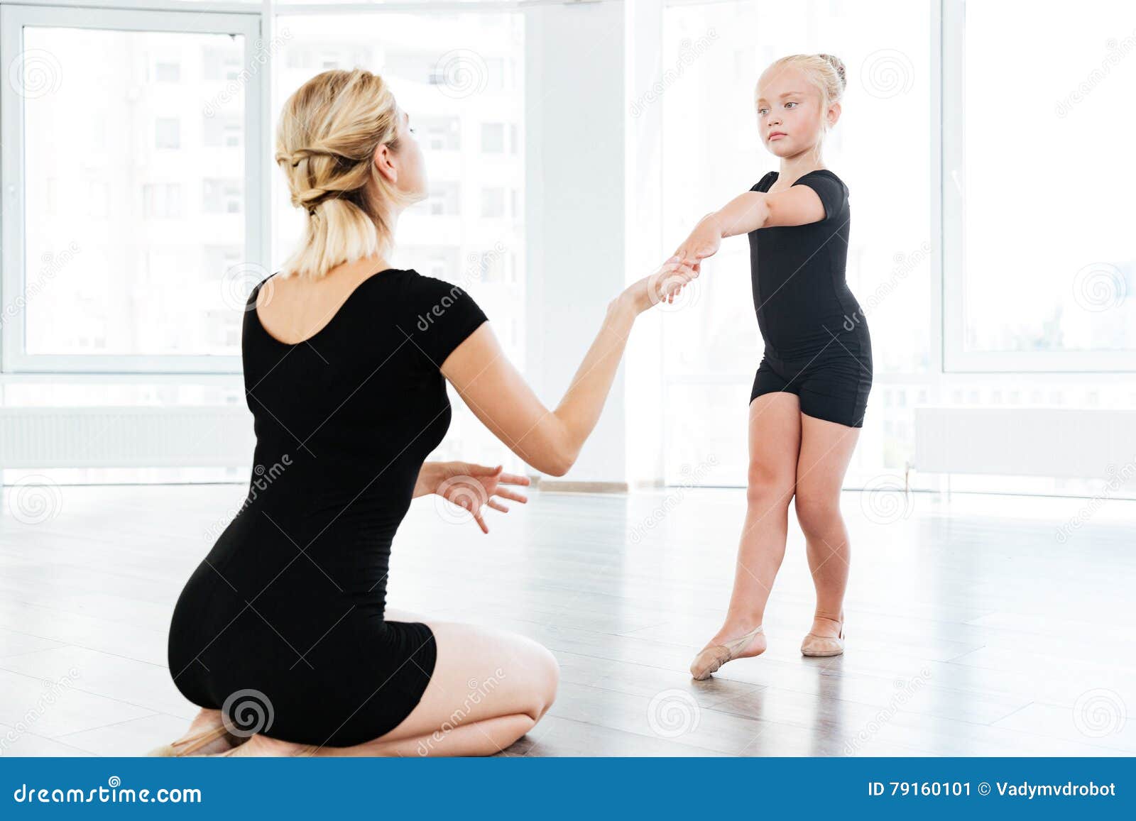 Ballet Instructor Directing Little Cute Ballerina during Dance Practice ...