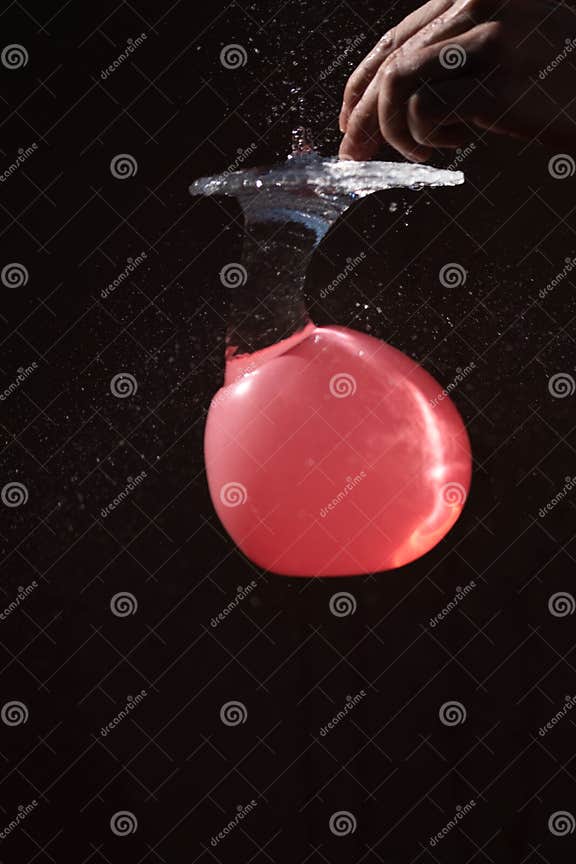 Balloon Filled with Water is Punctured Stock Photo - Image of impact ...
