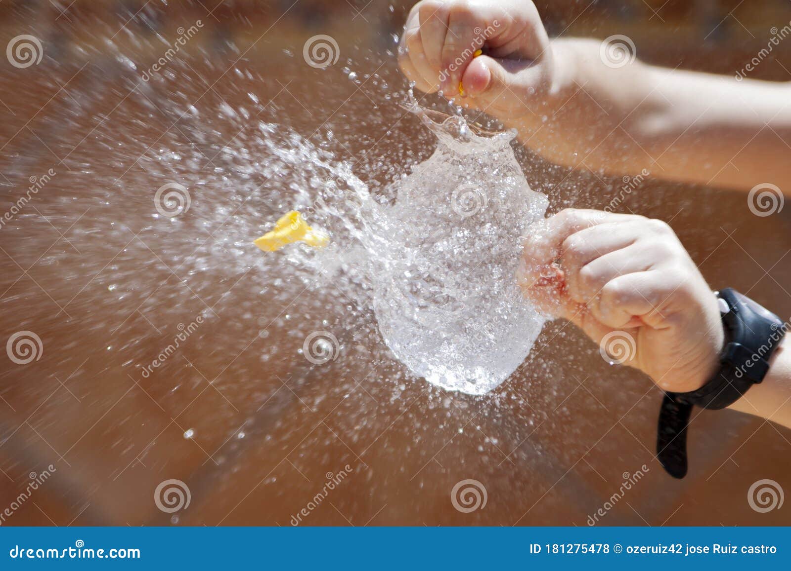 Balloon Full of Exploding Water, Held by a Child& X27;s Hands with a ...