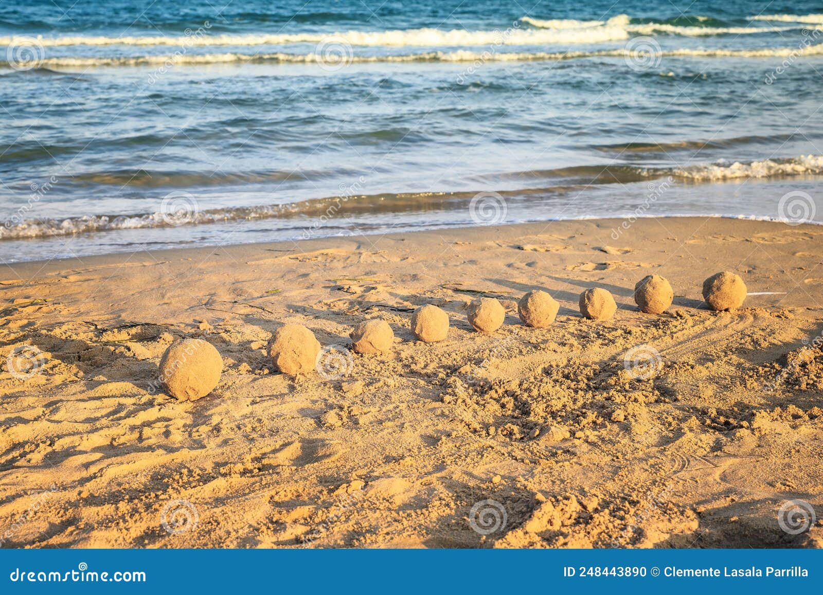 Balls Made of Sands on the Beach Shore Stock Photo - Image of child ...