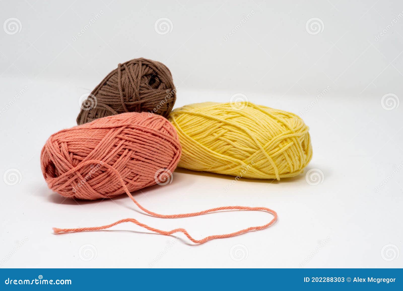 3 Balls of Wool with Trailing Pink End Stock Image - Image of knit ...