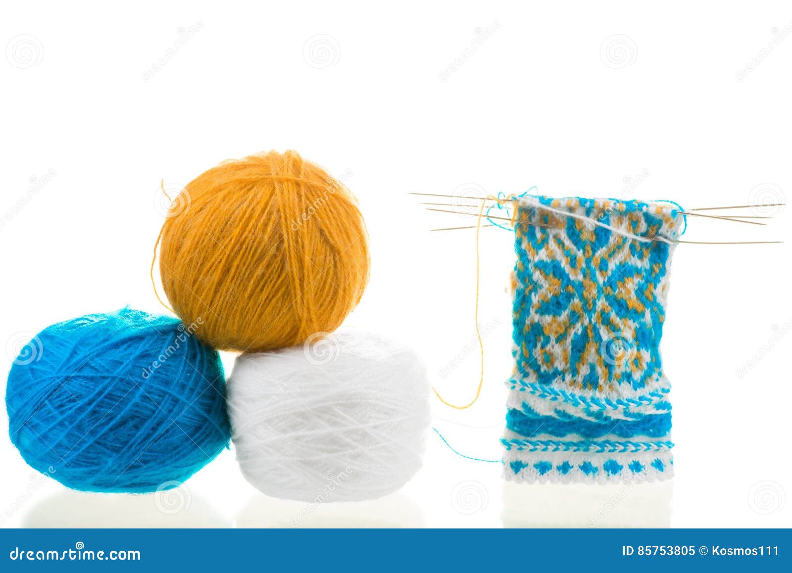 Balls of Wool Yarn and Part of Mittens with a Beautiful Pattern Stock ...