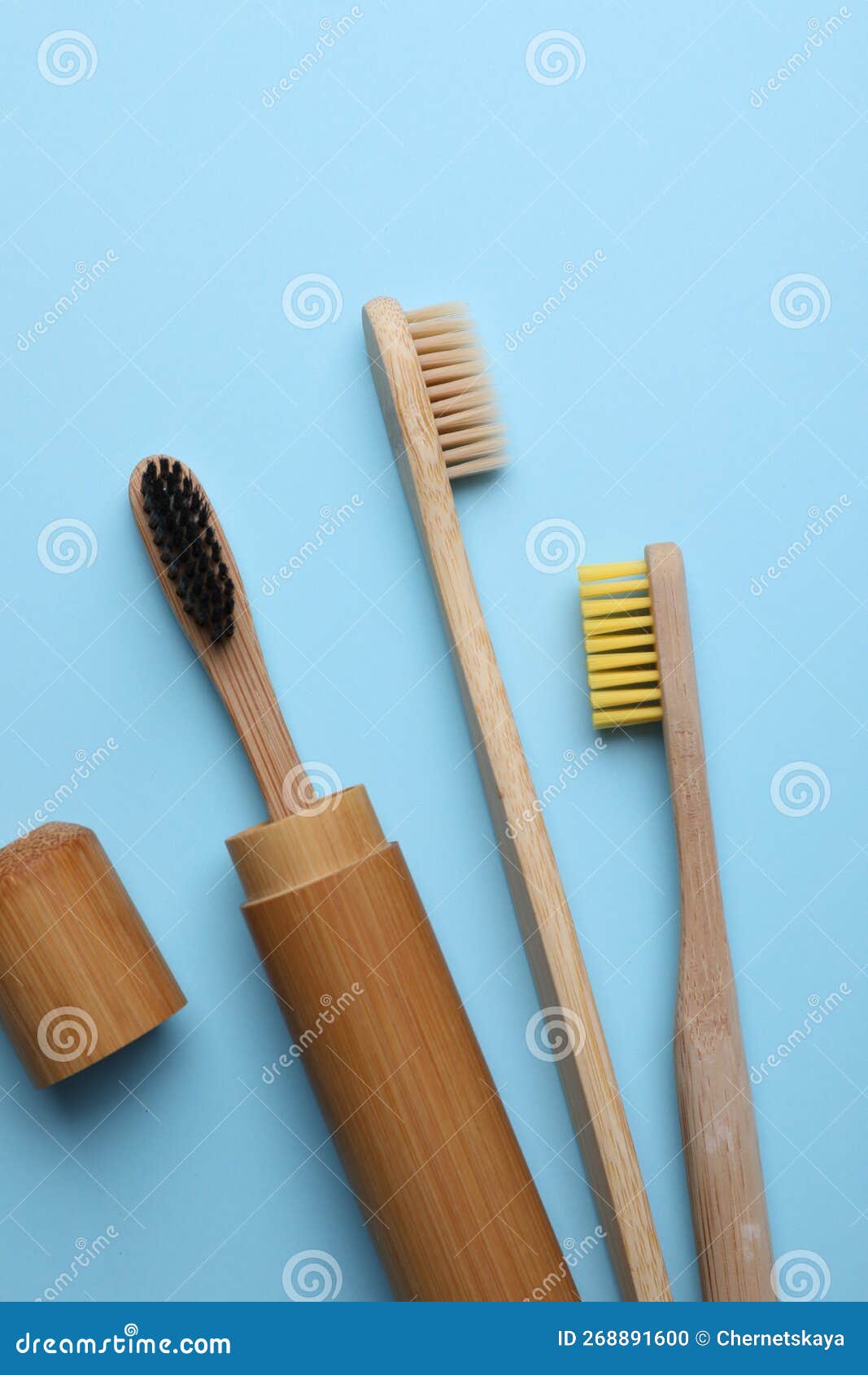 Bamboo Toothbrushes on Light Blue Background, Flat Lay Stock Photo ...