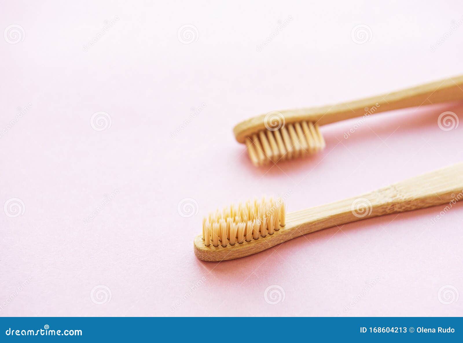 Bamboo Toothbrushes On Light Pink Background Stock Photo ...