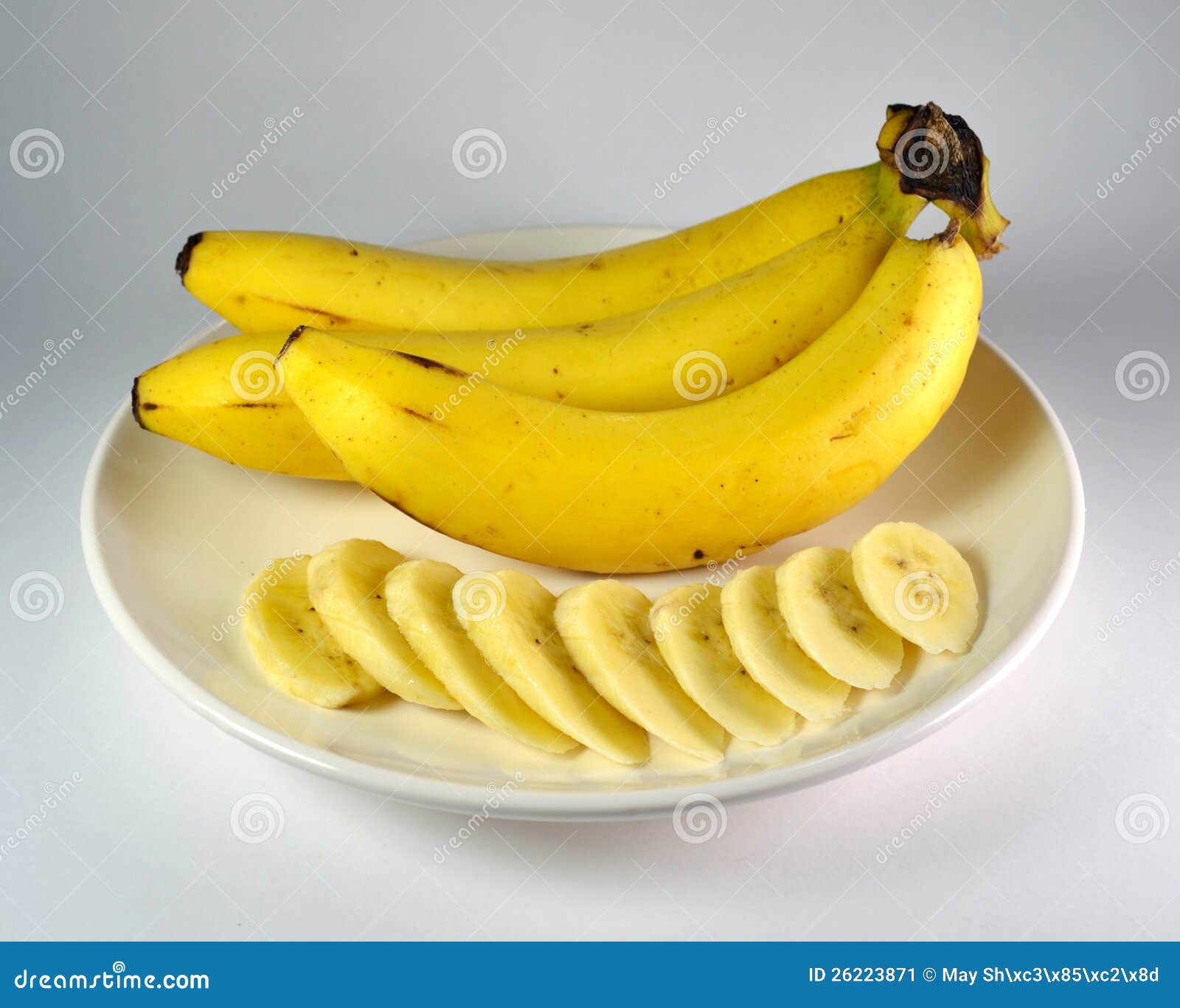 Banana on white plate stock image. Image of banana, long - 26223871