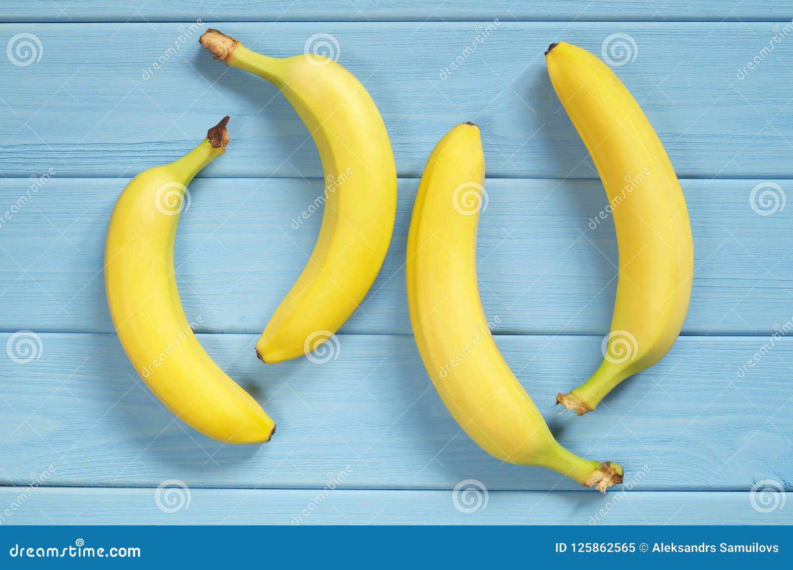 Bananas on a Blue Background Stock Image - Image of banana, yellow ...
