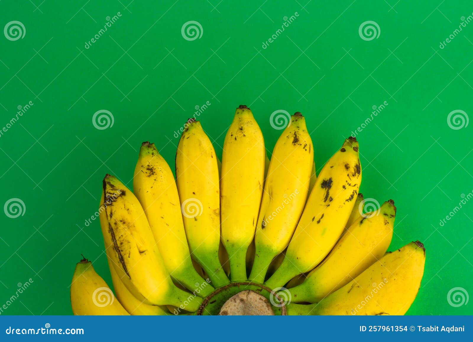 Bananas on a Green Background with Negative Space Stock Photo - Image ...