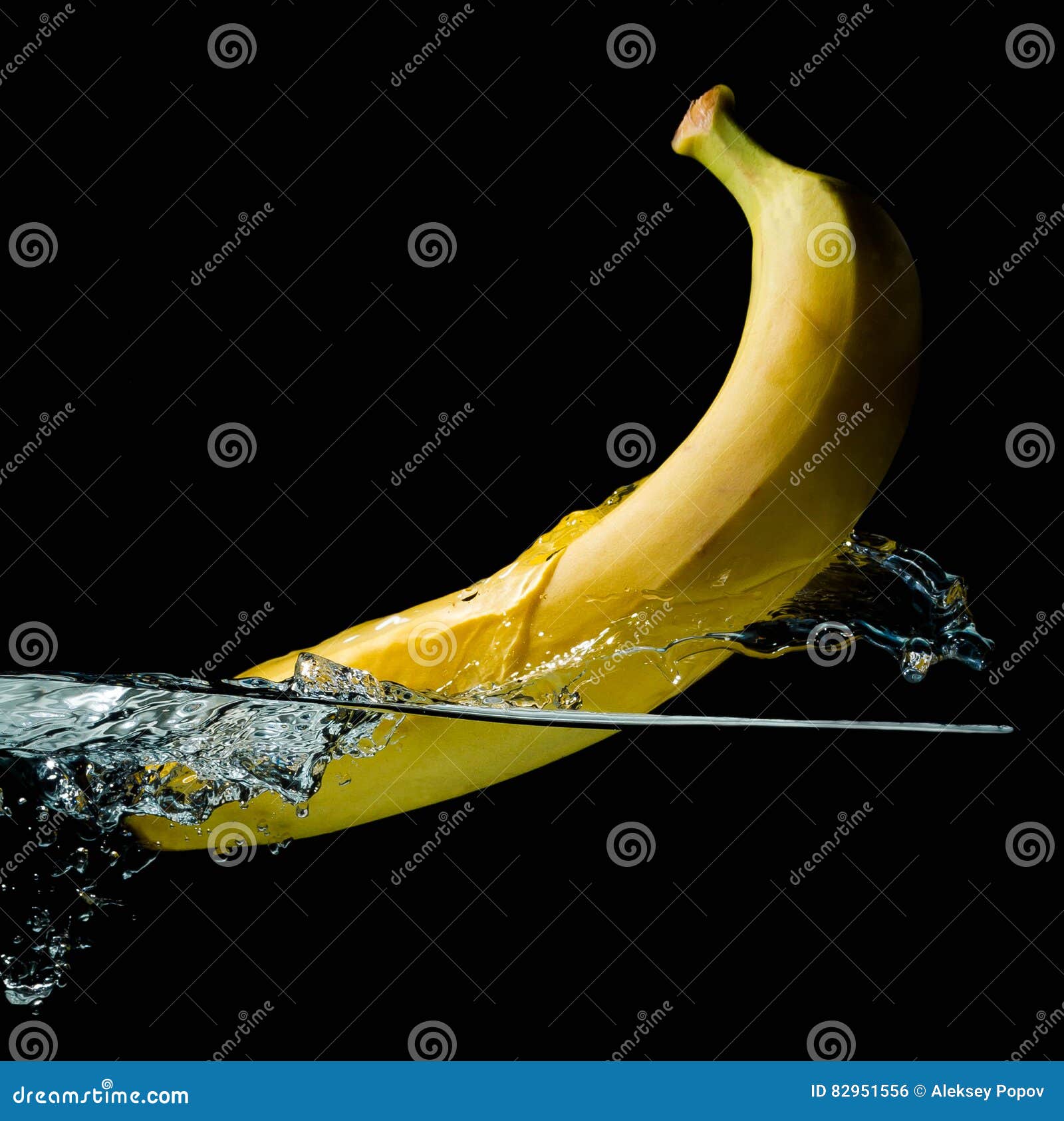 Bananas Splash in Water To Movement Over Black Background Stock Photo ...