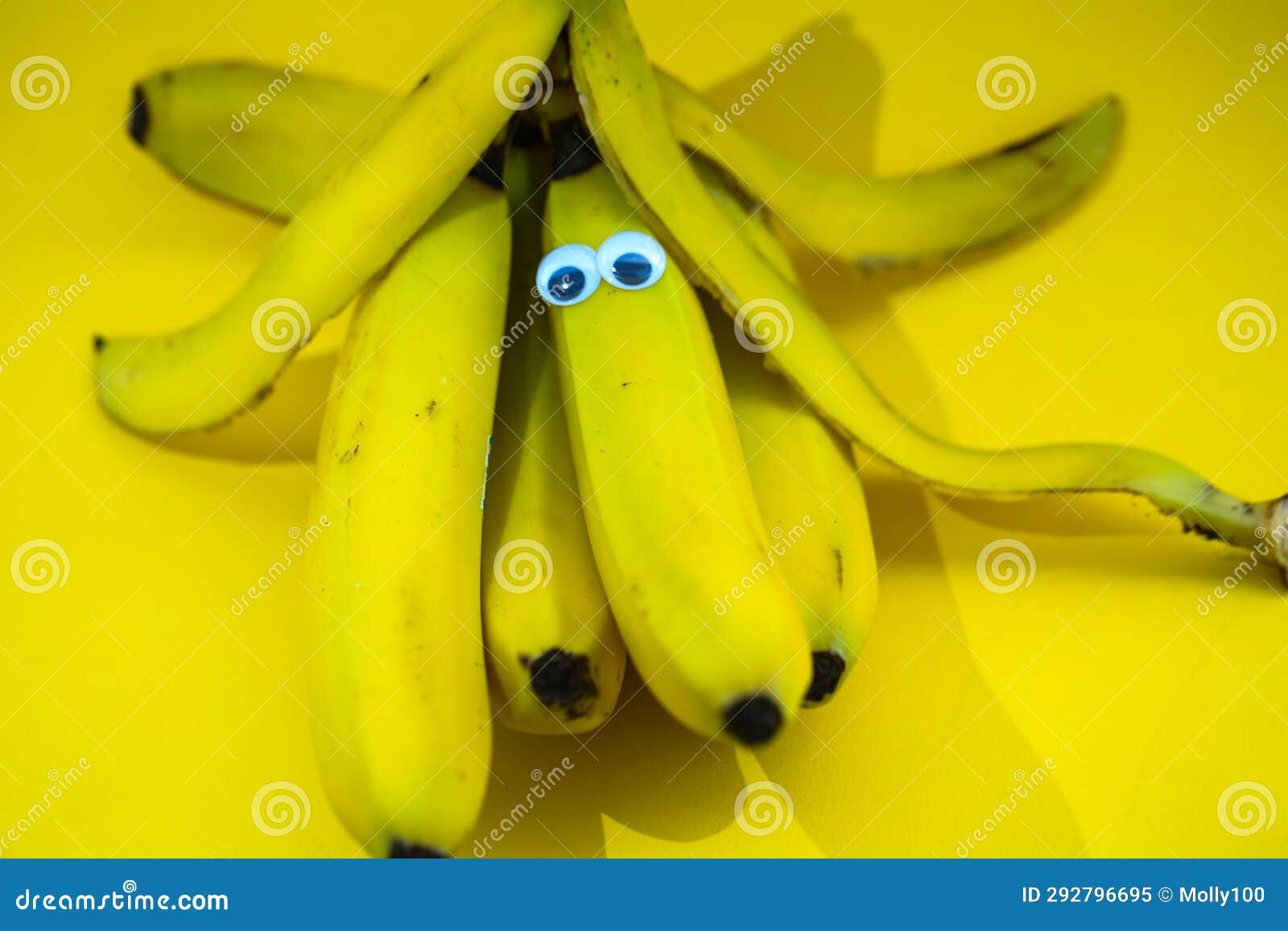 Bananas On A String, Yellow Background, Funny Bananas With Eyes ... Bananas On A String, Yellow Background, Funny Bananas With Eyes ...