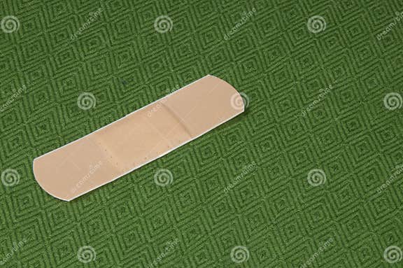 Band Aid on Green stock photo. Image of injury, bandage - 10959116