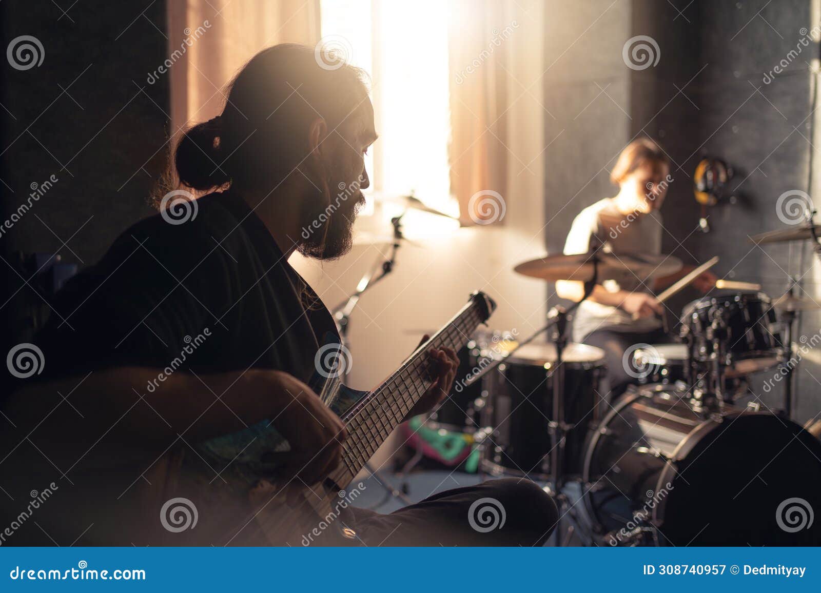 Band Members Practicing in a Music Studio with Focus on Guitarist Stock ...