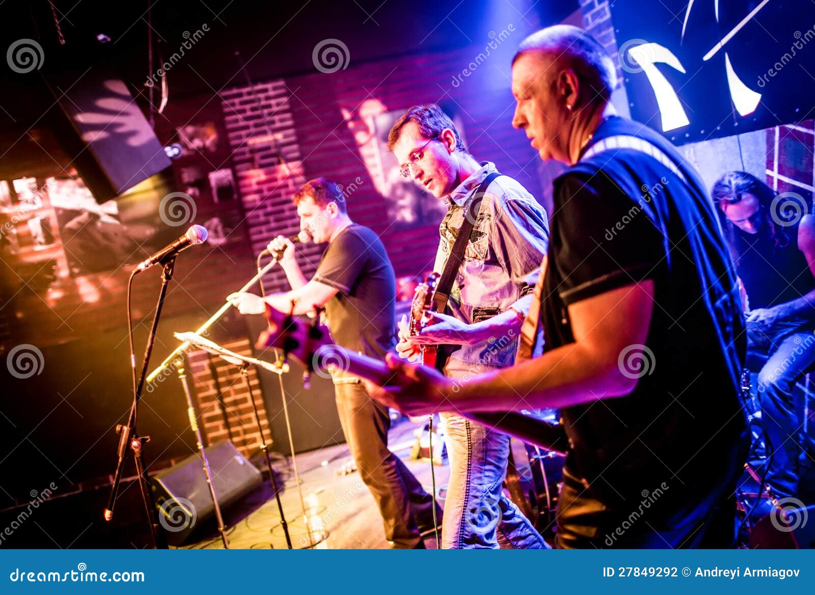 Band performs on stage stock photo. Image of band, person - 27849292