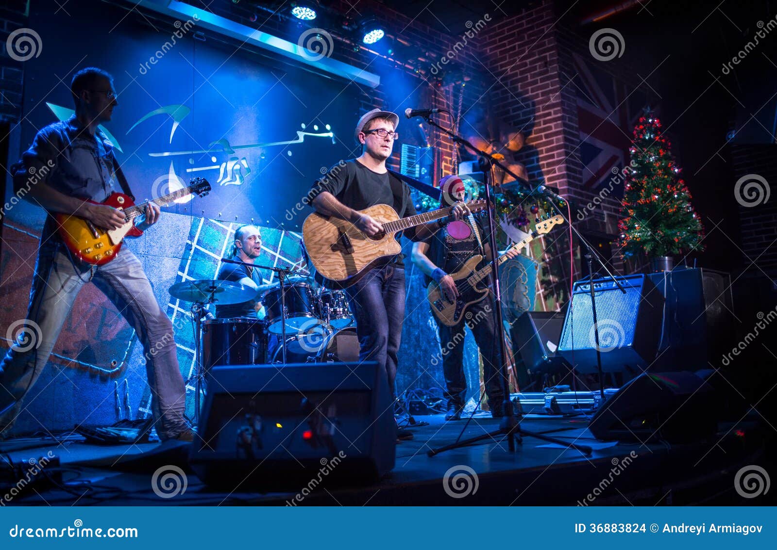 Band performs on stage stock photo. Image of guitarist - 36883824
