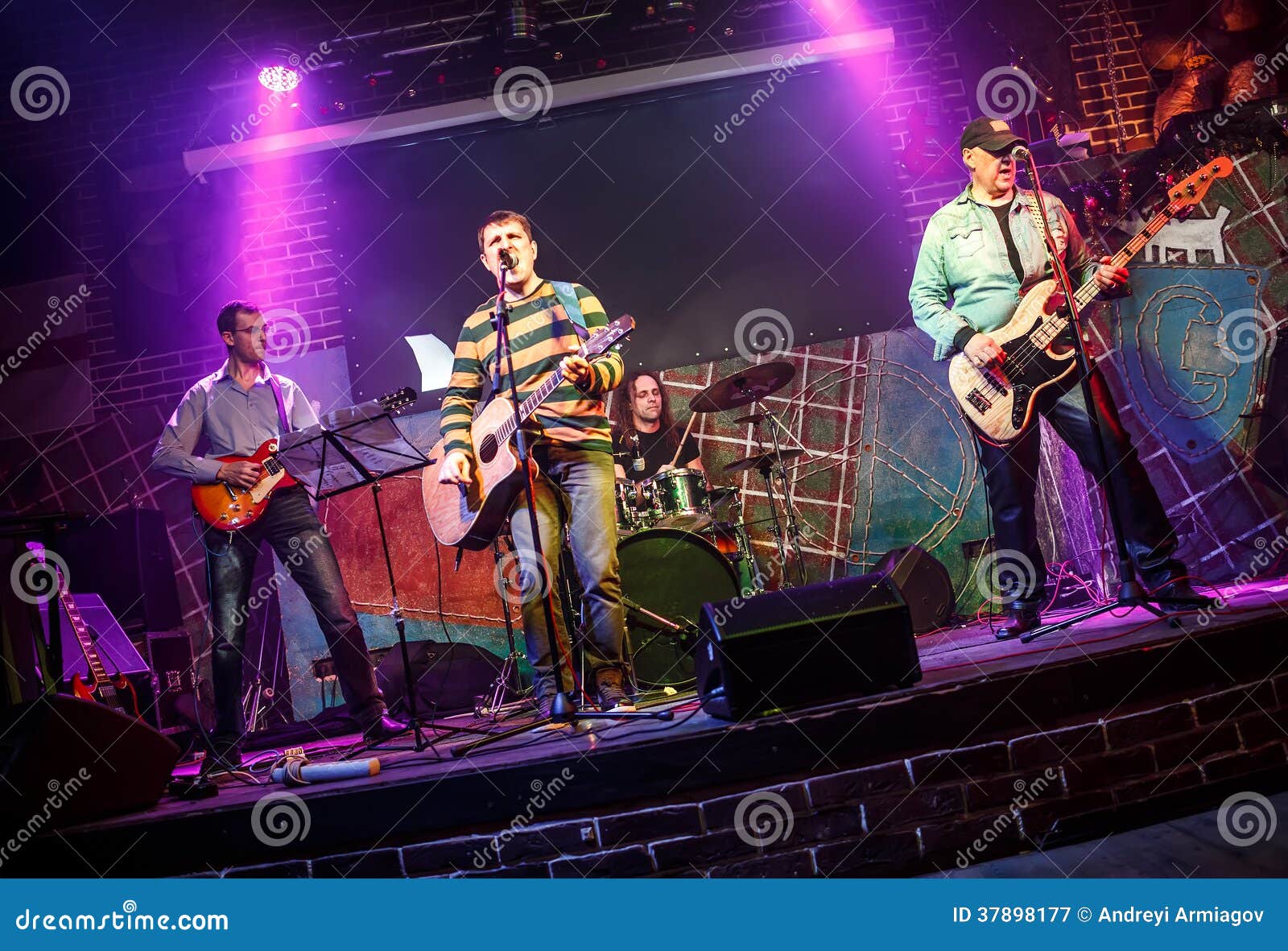 Band performs on stage stock image. Image of people, play - 37898177