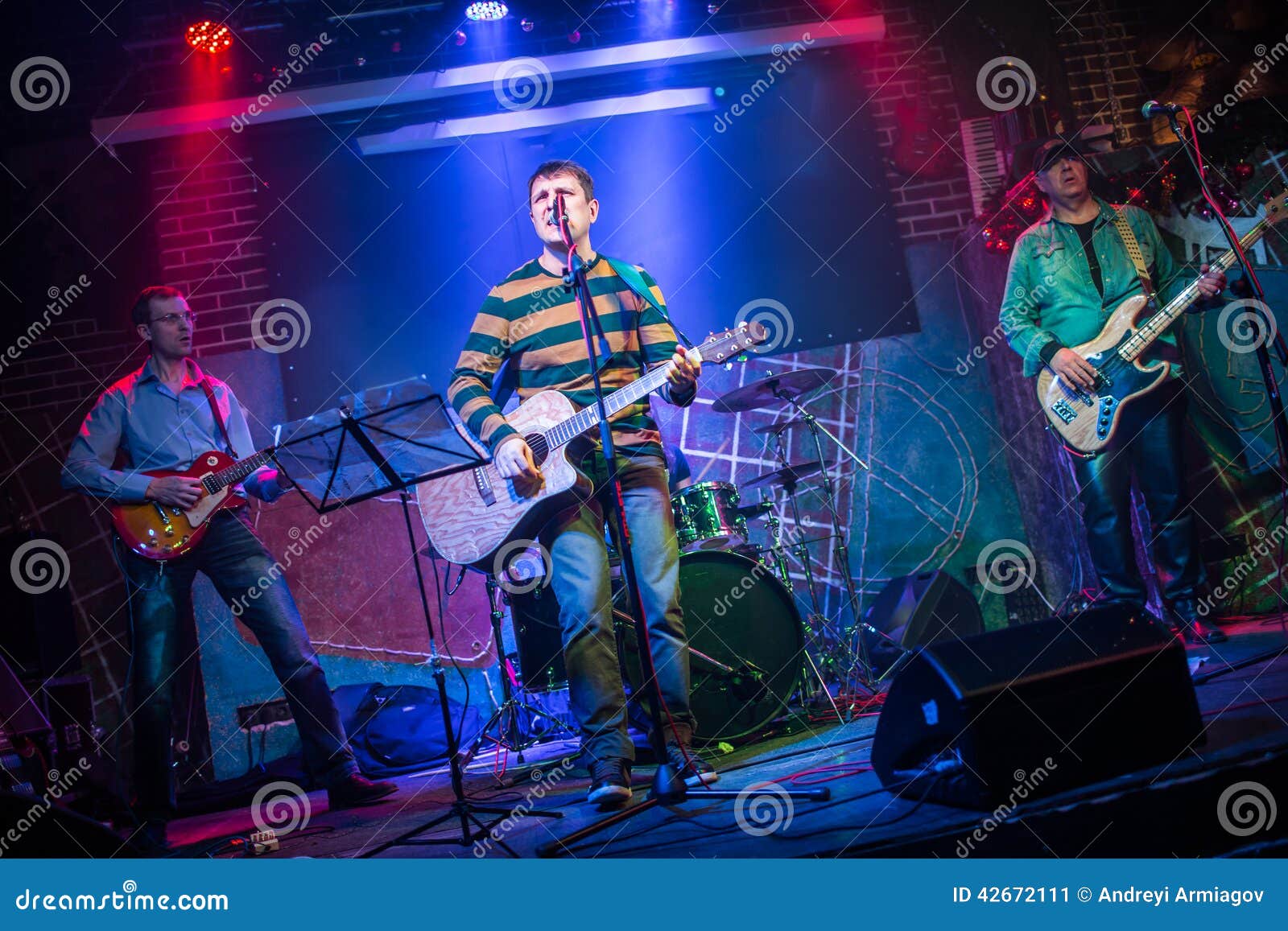 Band performs on stage stock image. Image of person, group - 42672111