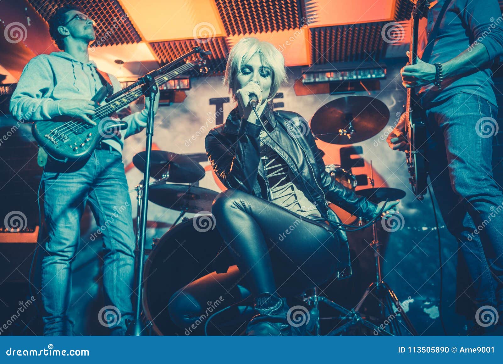 Band Playing on Stage Making Music Stock Photo - Image of singing ...
