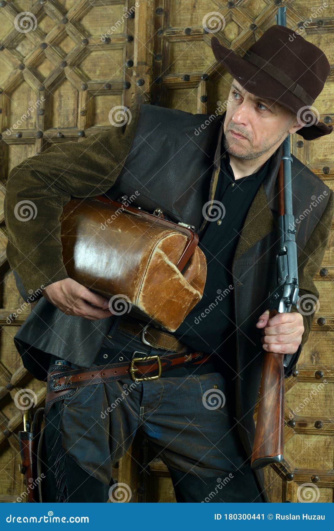 Bandit with Gun in the Wild West Stock Image - Image of poncho, valise ...