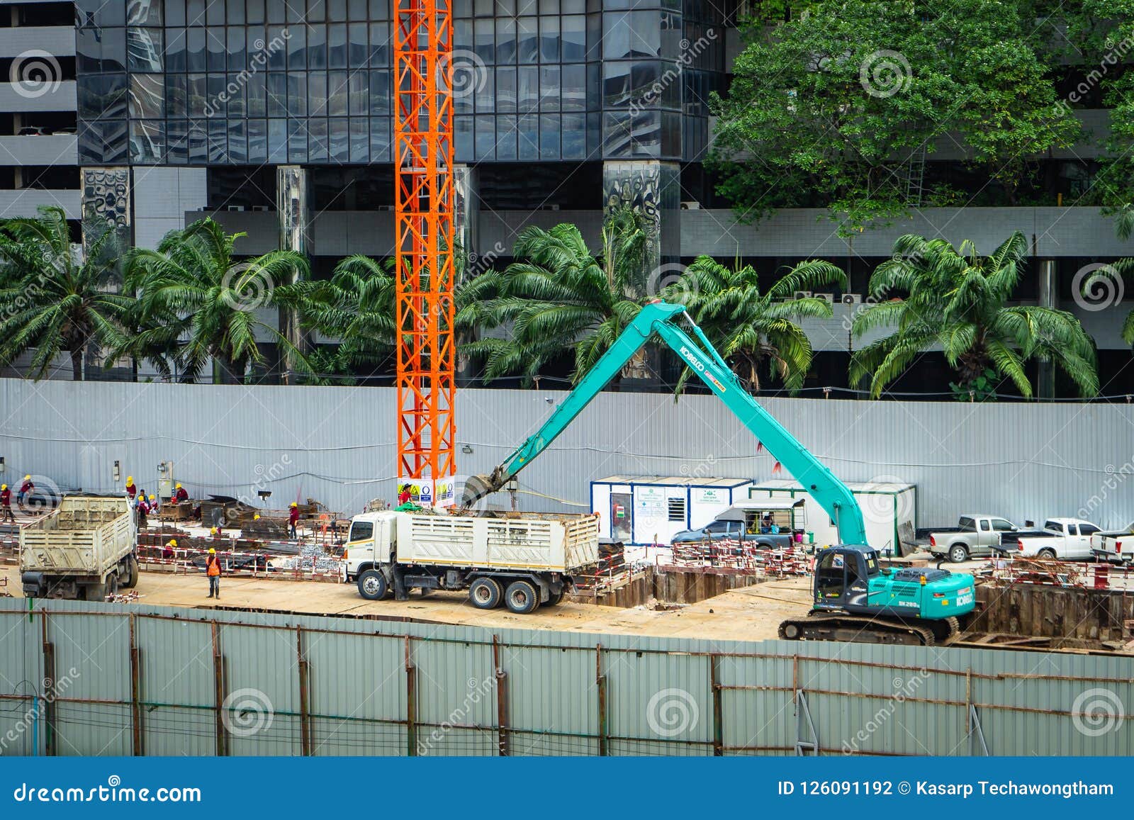 Excavator Load The Sand To The Heavy Mining Truck In The Open-pit ...