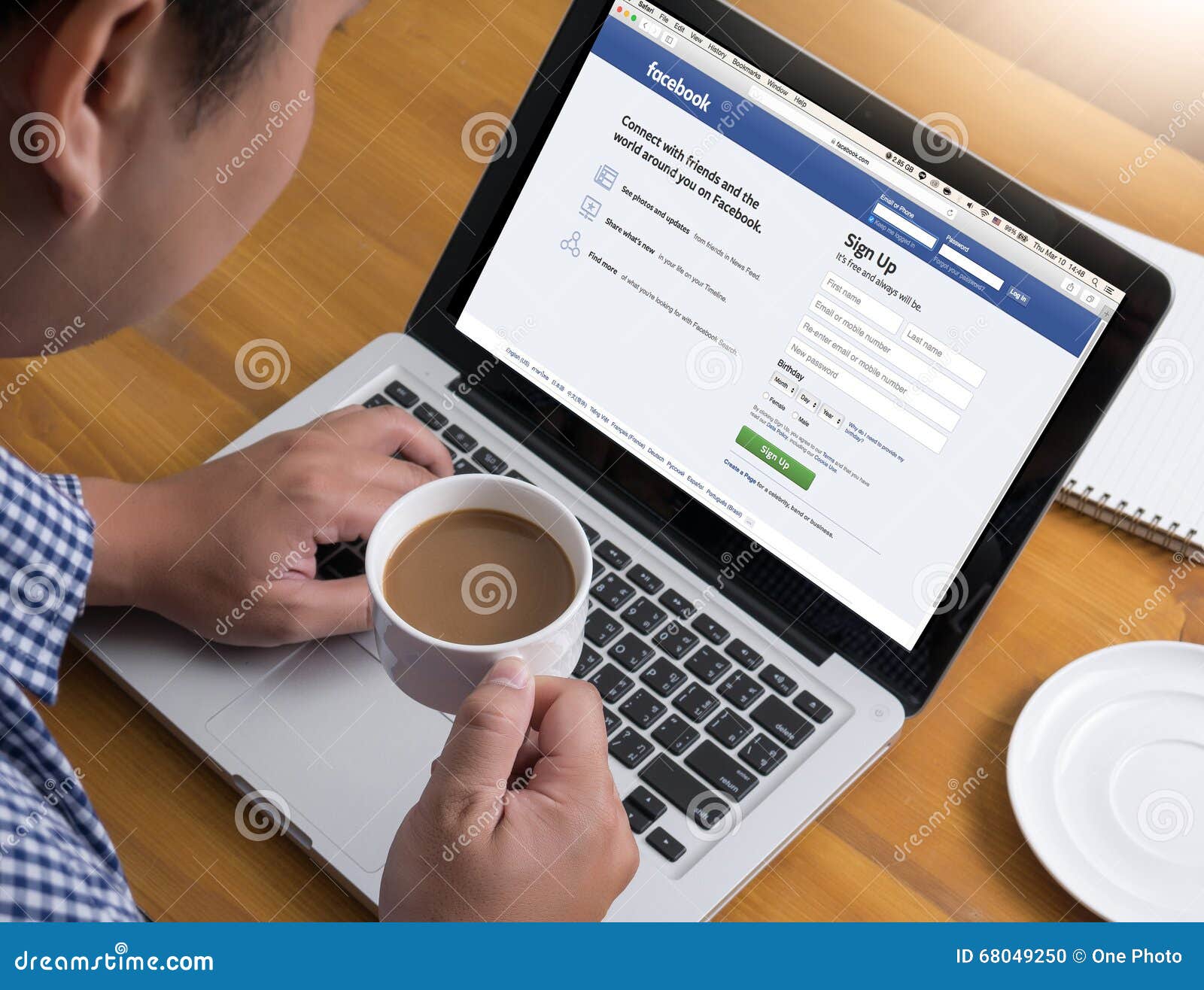 Bangkok, Thailand - Mar 10, 2015: Man on a Computer Browsing Facebook ... Bangkok, Thailand - Mar 10, 2015: Man on a Computer Browsing Facebook ...