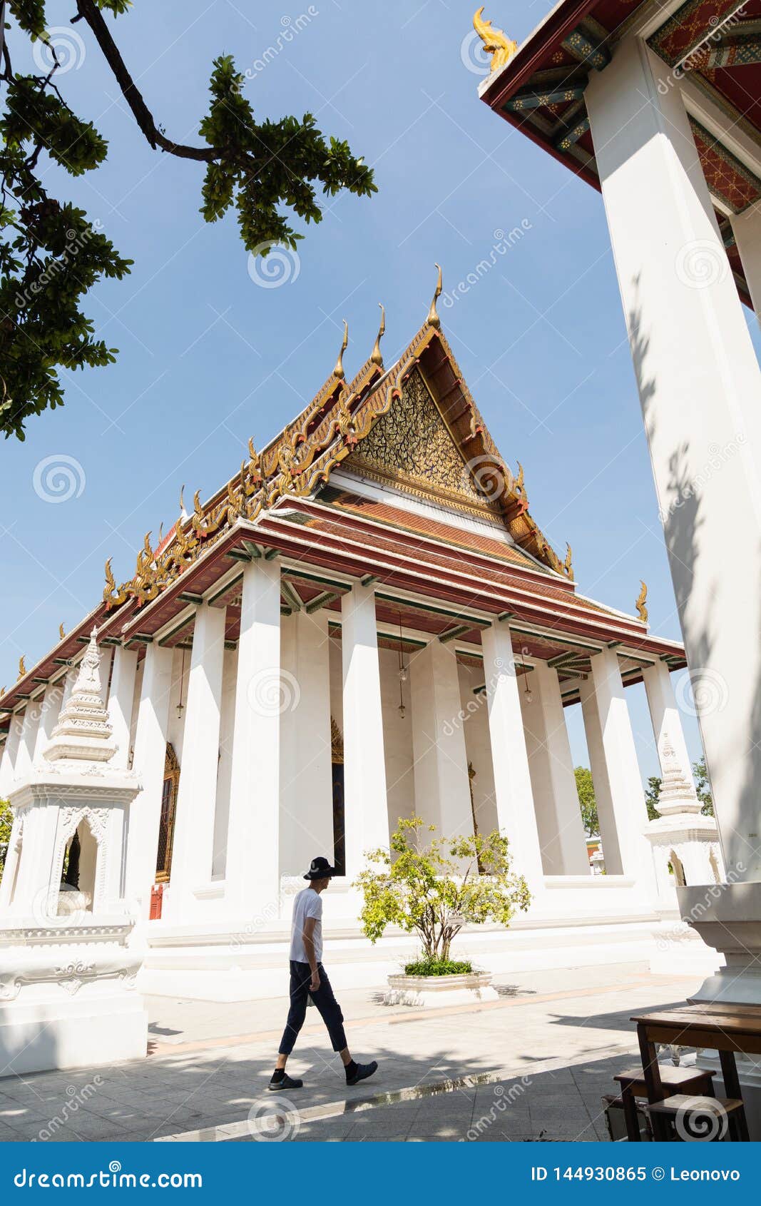 Bangkok, Thailand - March 2019: Man in a Straw Hat Walking in the Wat ...